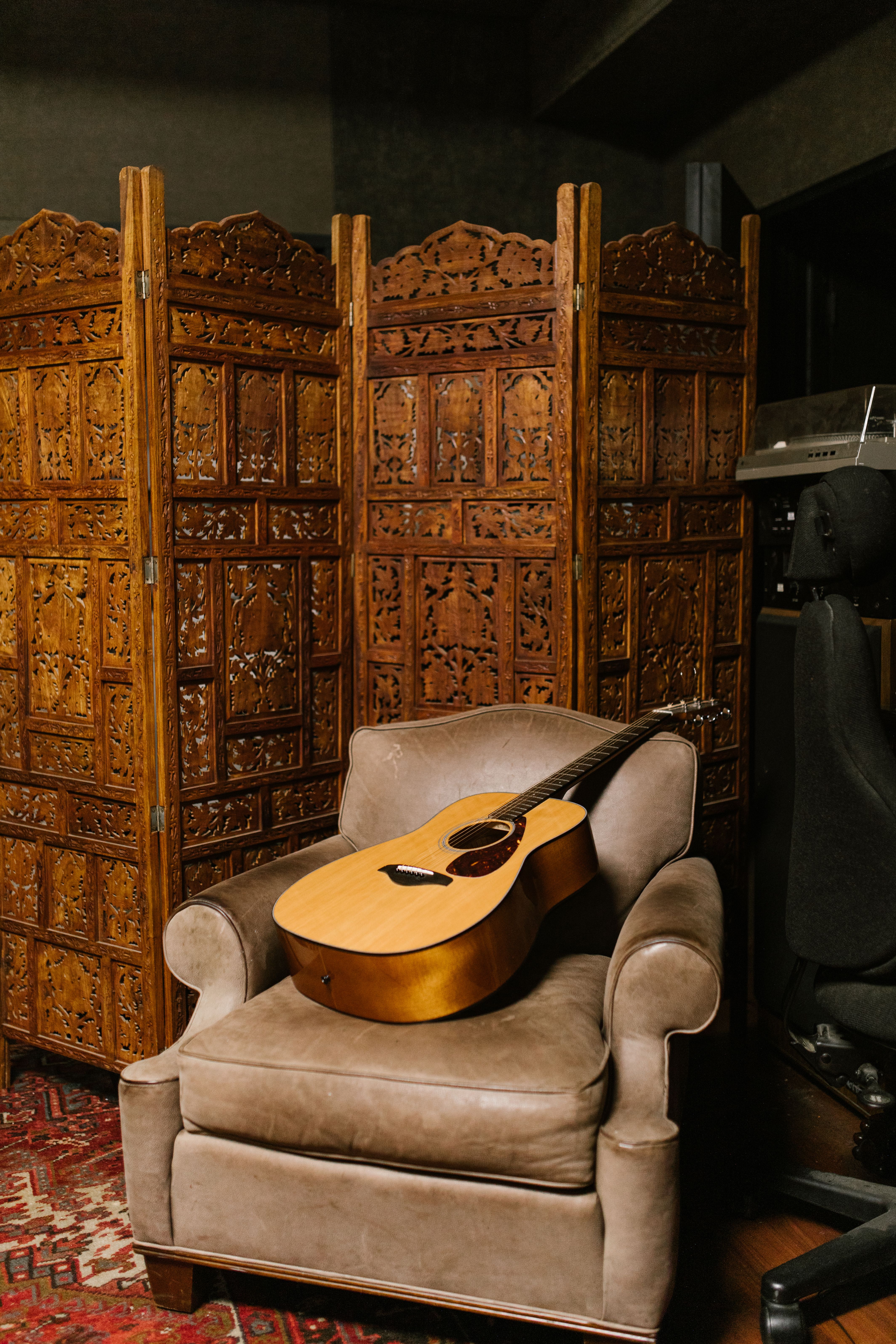 A Guitar on the Sofa · Free Stock Photo