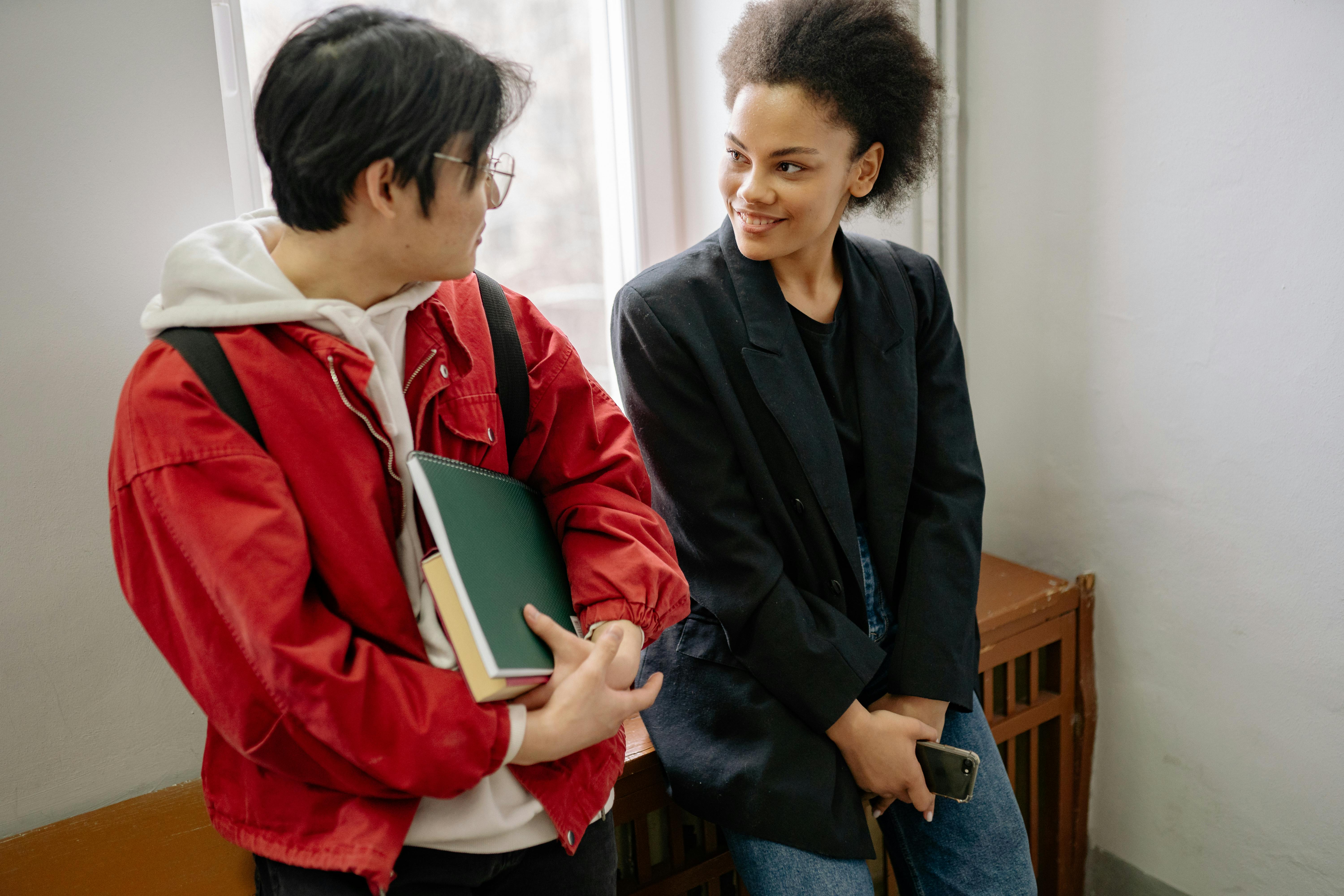 Laughing Students in Corridor · Free Stock Photo