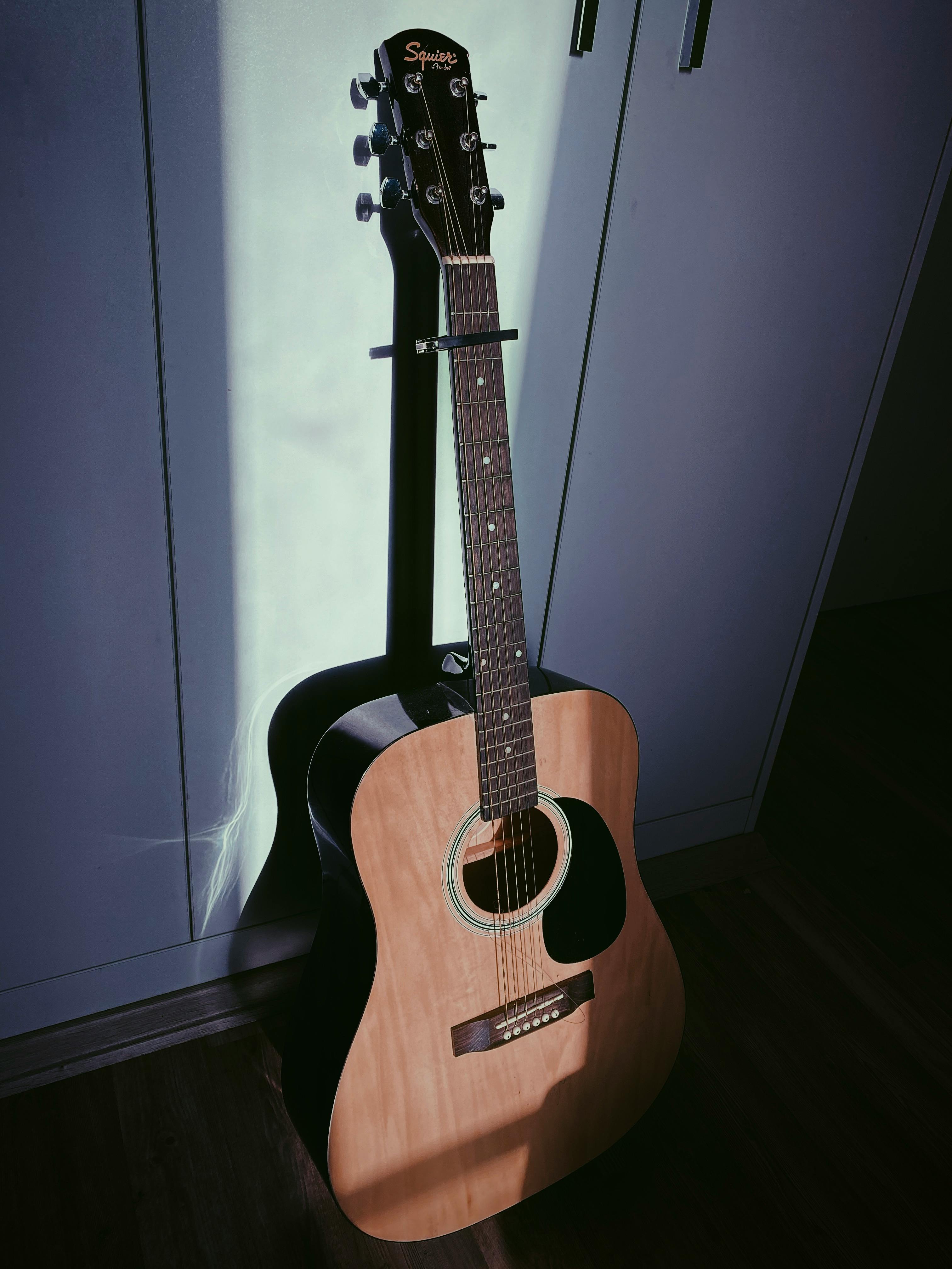 Close-Up Shot of an Acoustic Guitar · Free Stock Photo