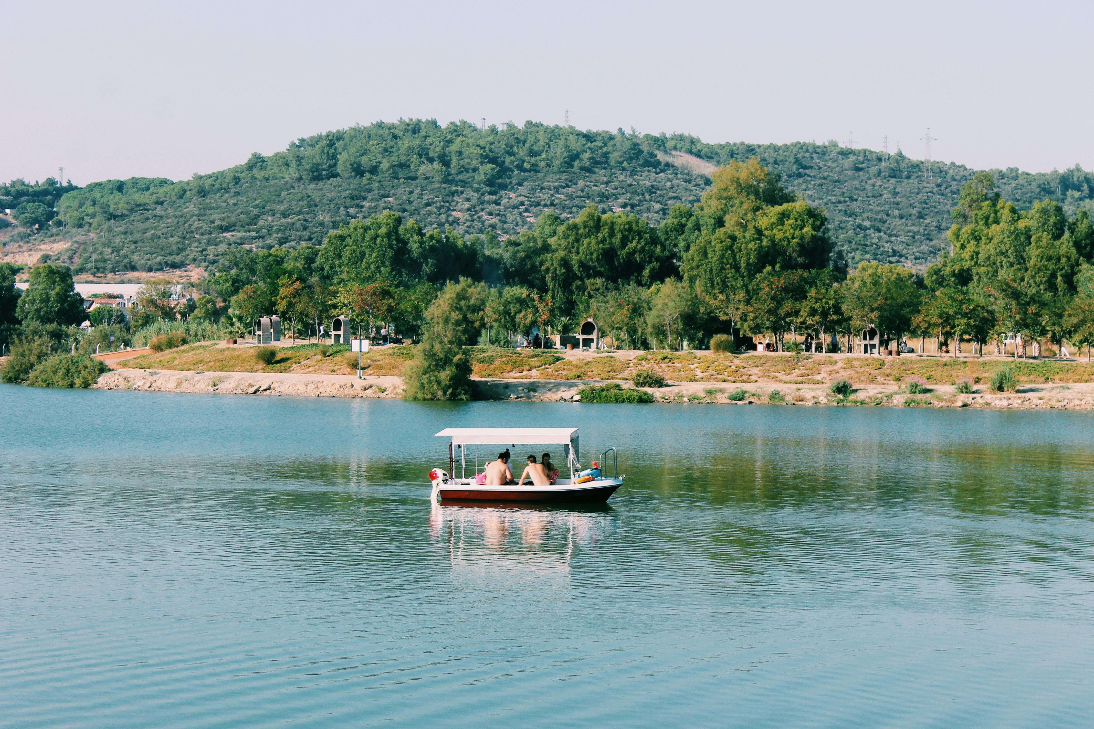 Boat on Sea and Landscape with Hill · Free Stock Photo