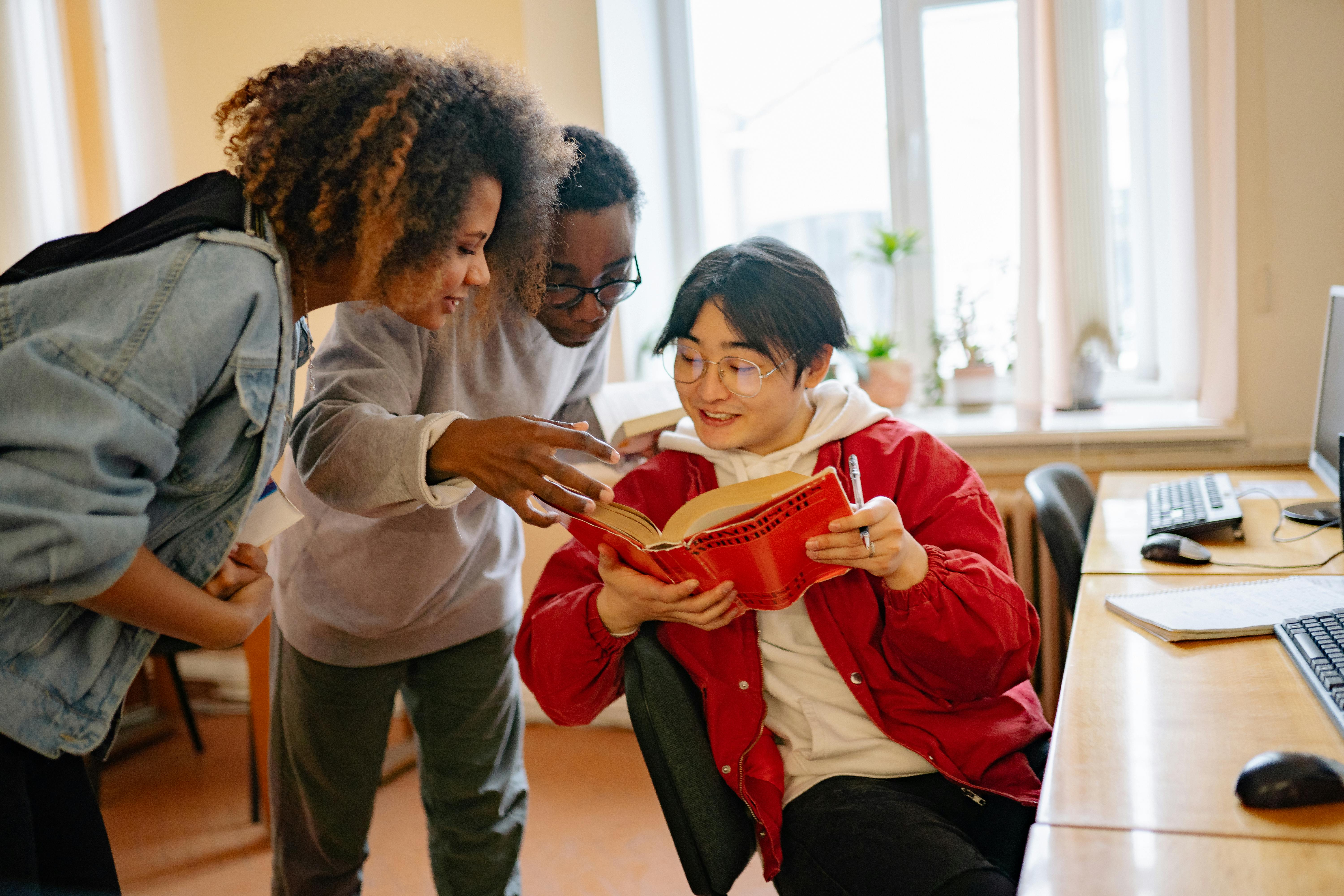 Three People in the Library · Free Stock Photo
