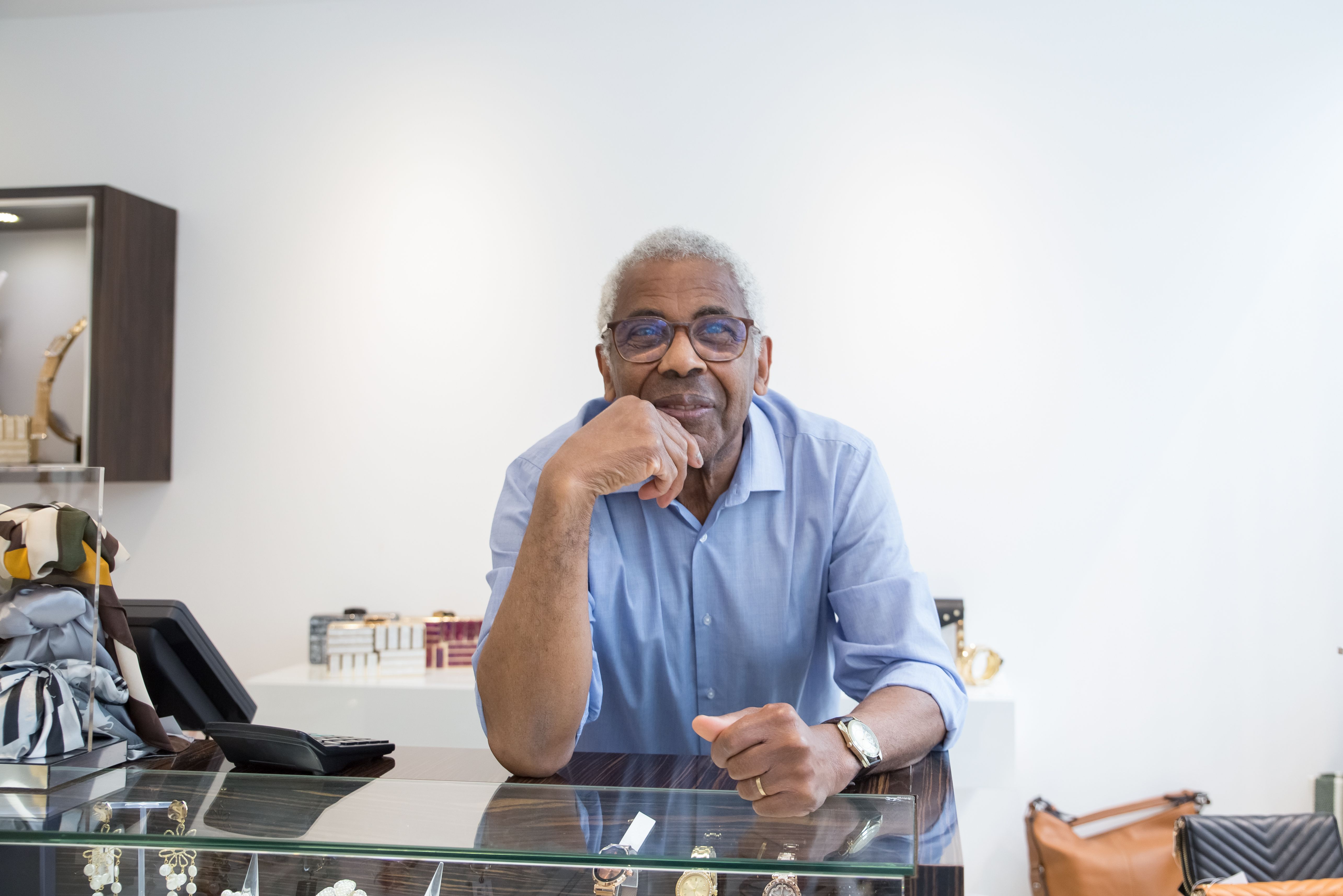 Elderly Man Computing His Sales Using a Calculator · Free Stock Photo