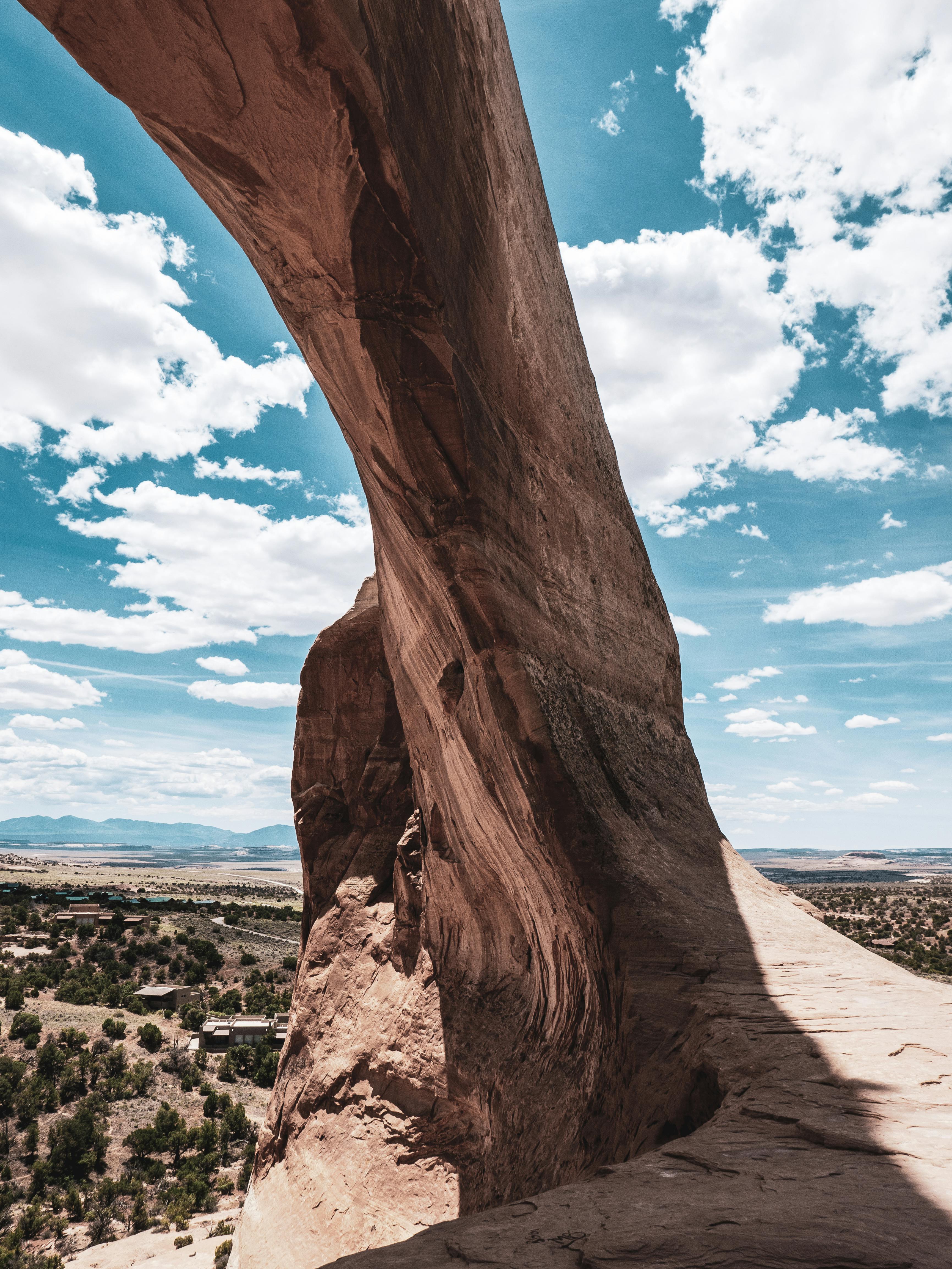 Sunset Over Rock Formation and Sea · Free Stock Photo