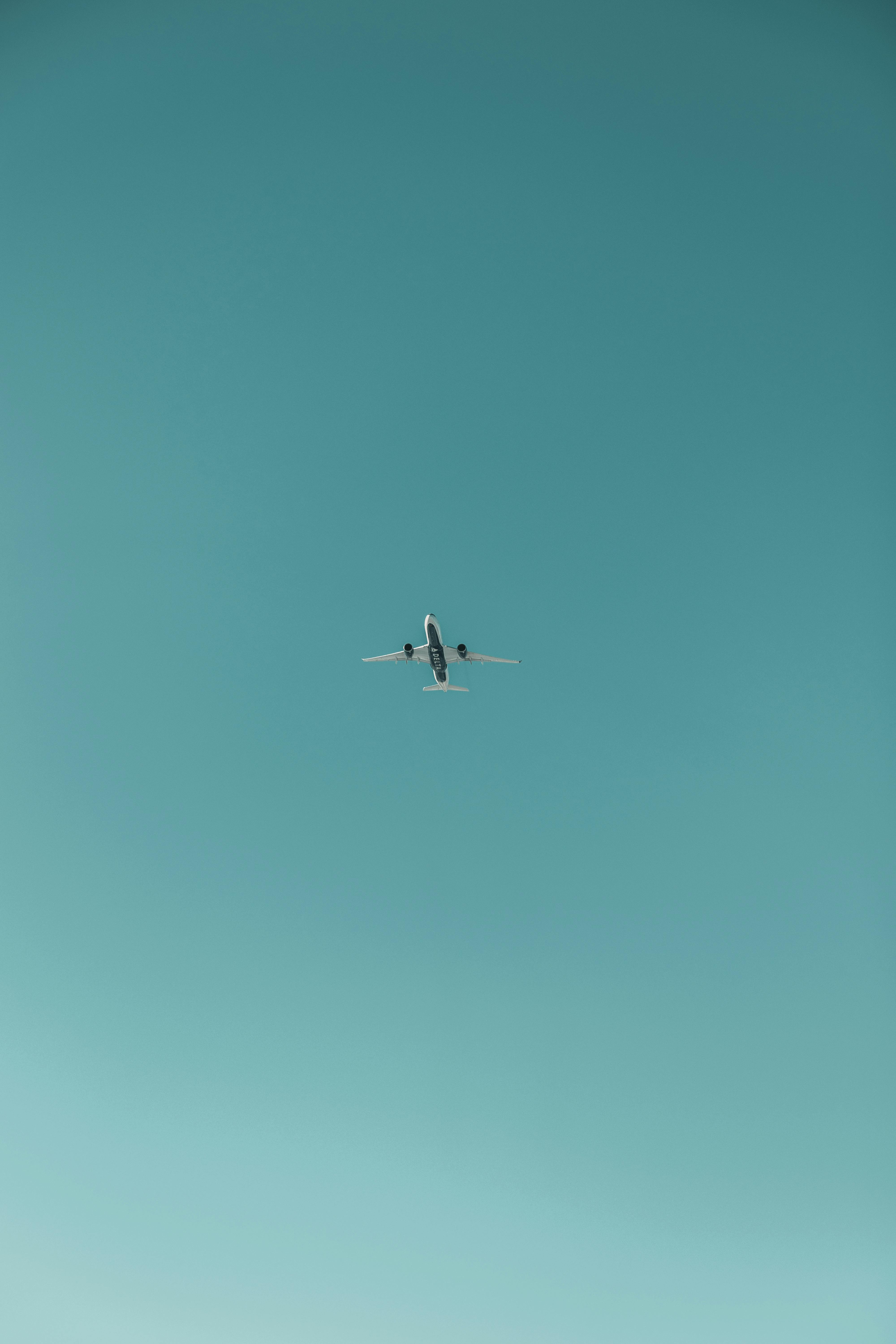 White Airplane in Mid Air · Free Stock Photo