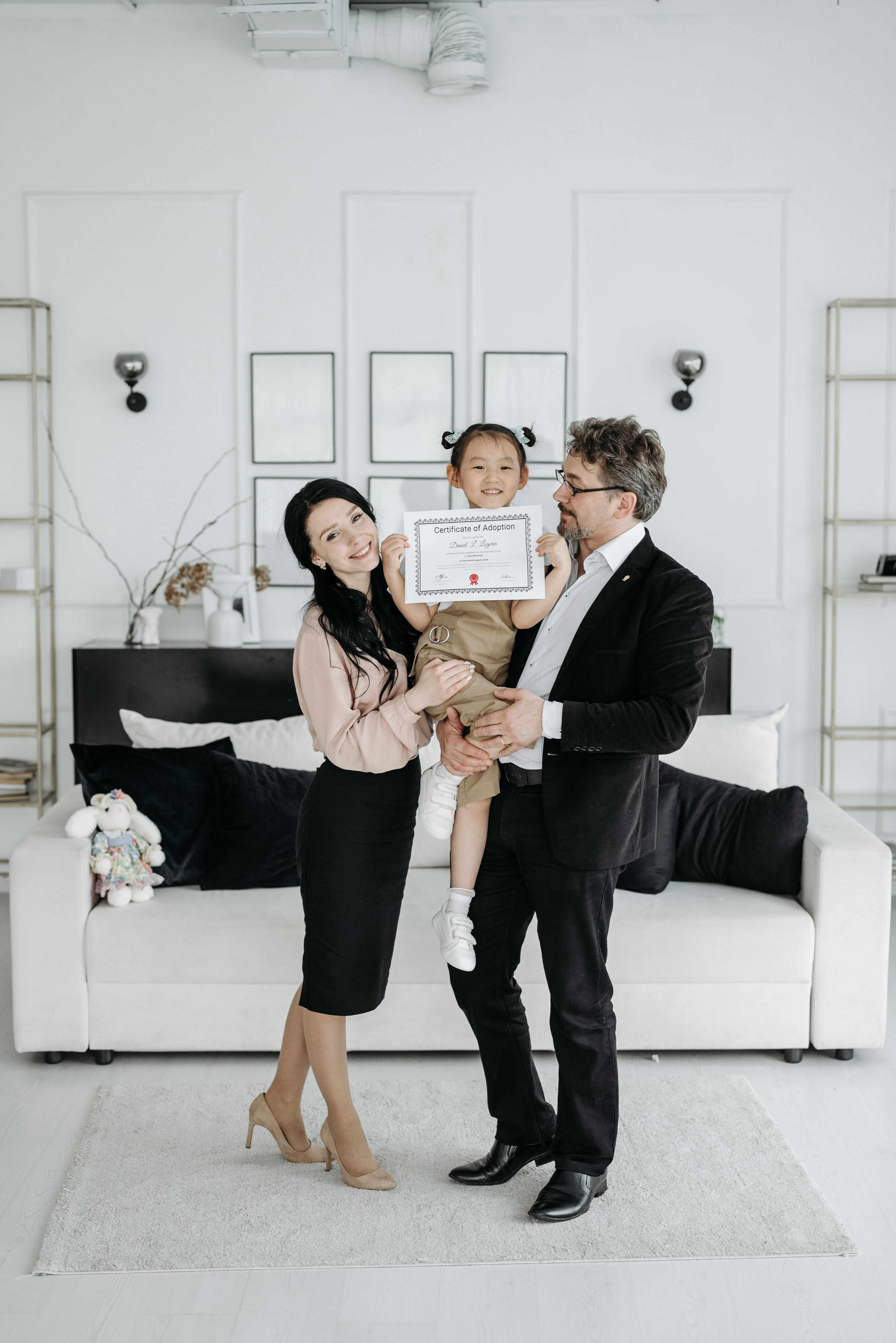 A Married Couple Adopting a Child · Free Stock Photo