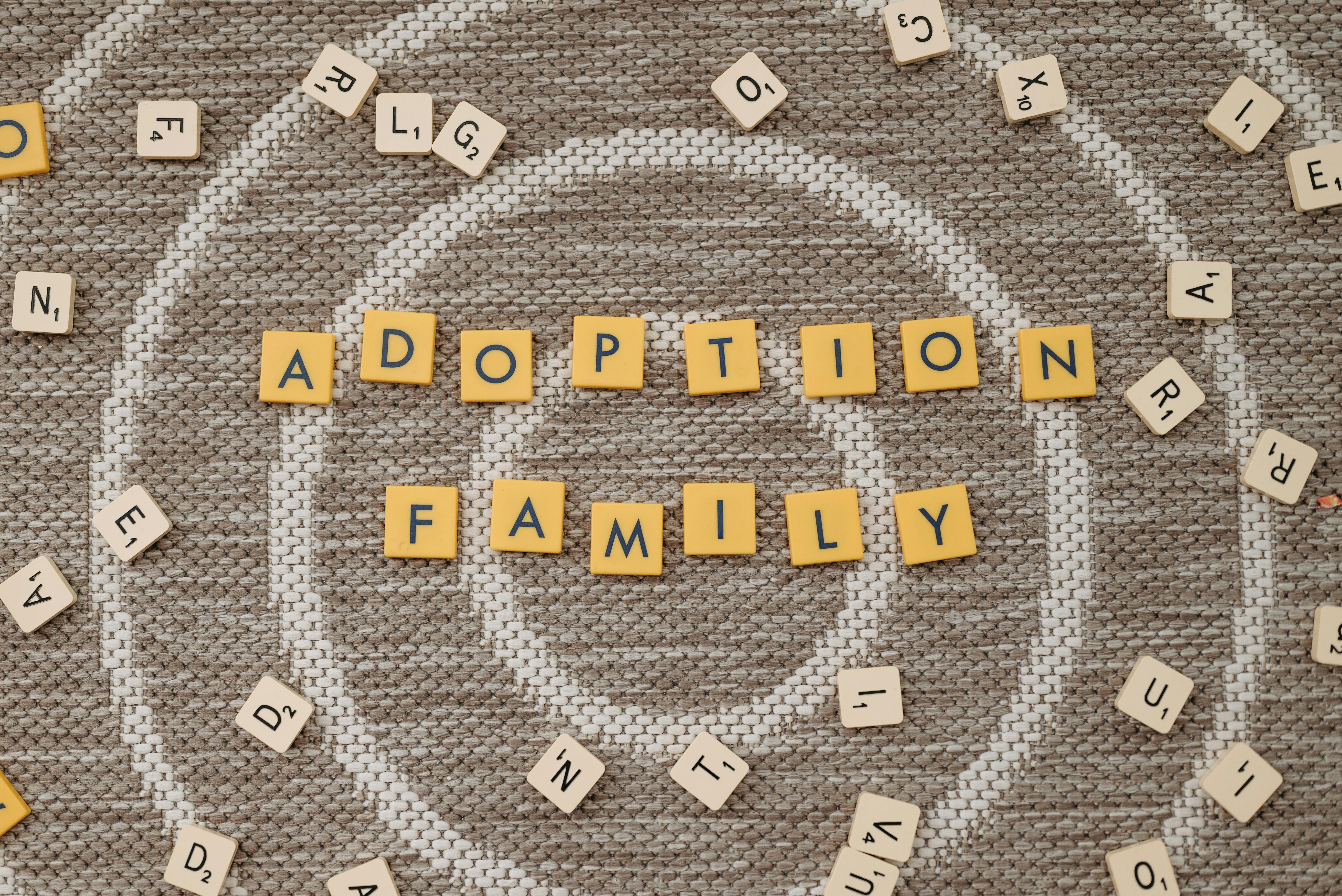 A Text Saying "Adoption Family " Made from Tiles with Letters on the ...