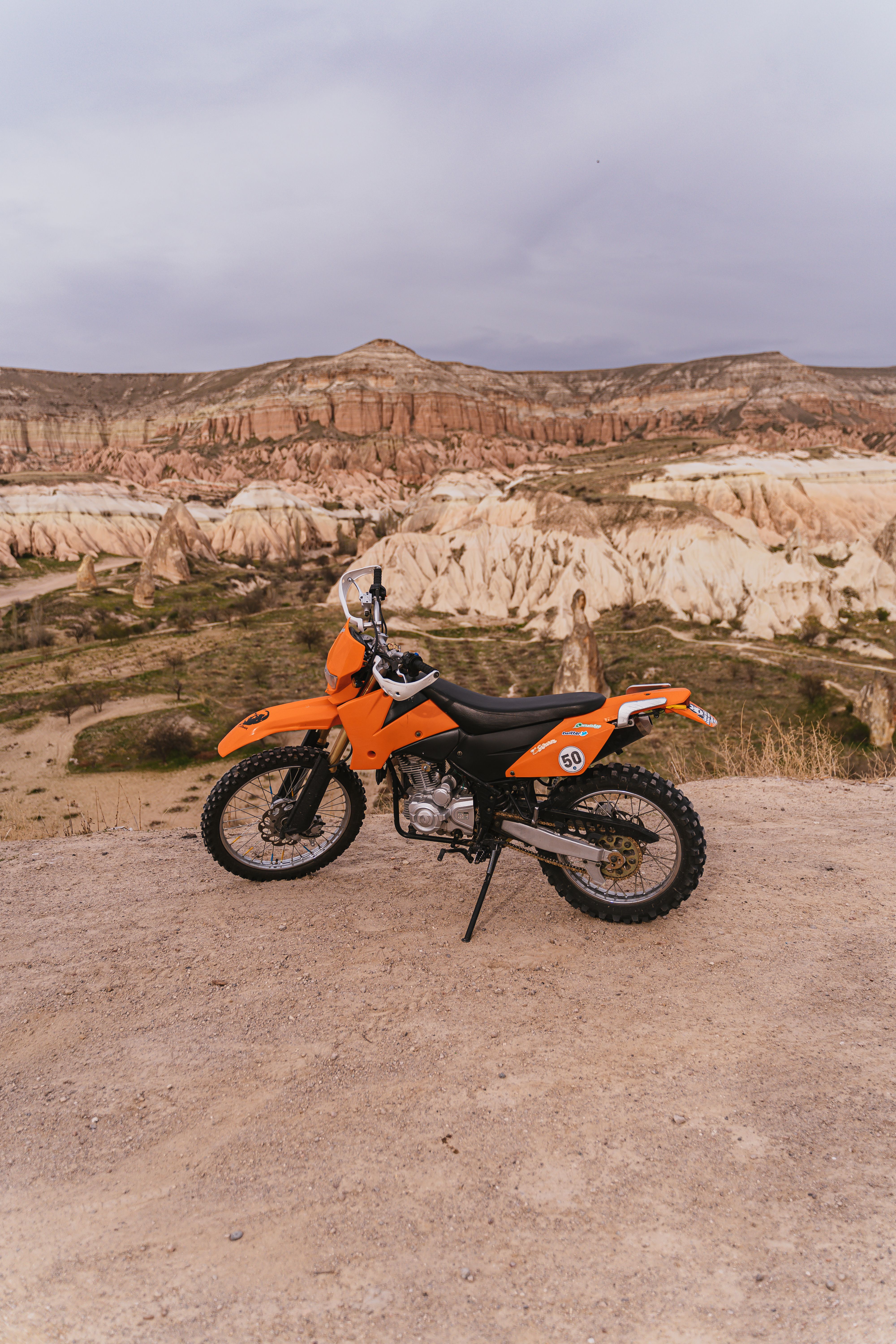 Orange Motorcycle on the Brown Sand · Free Stock Photo