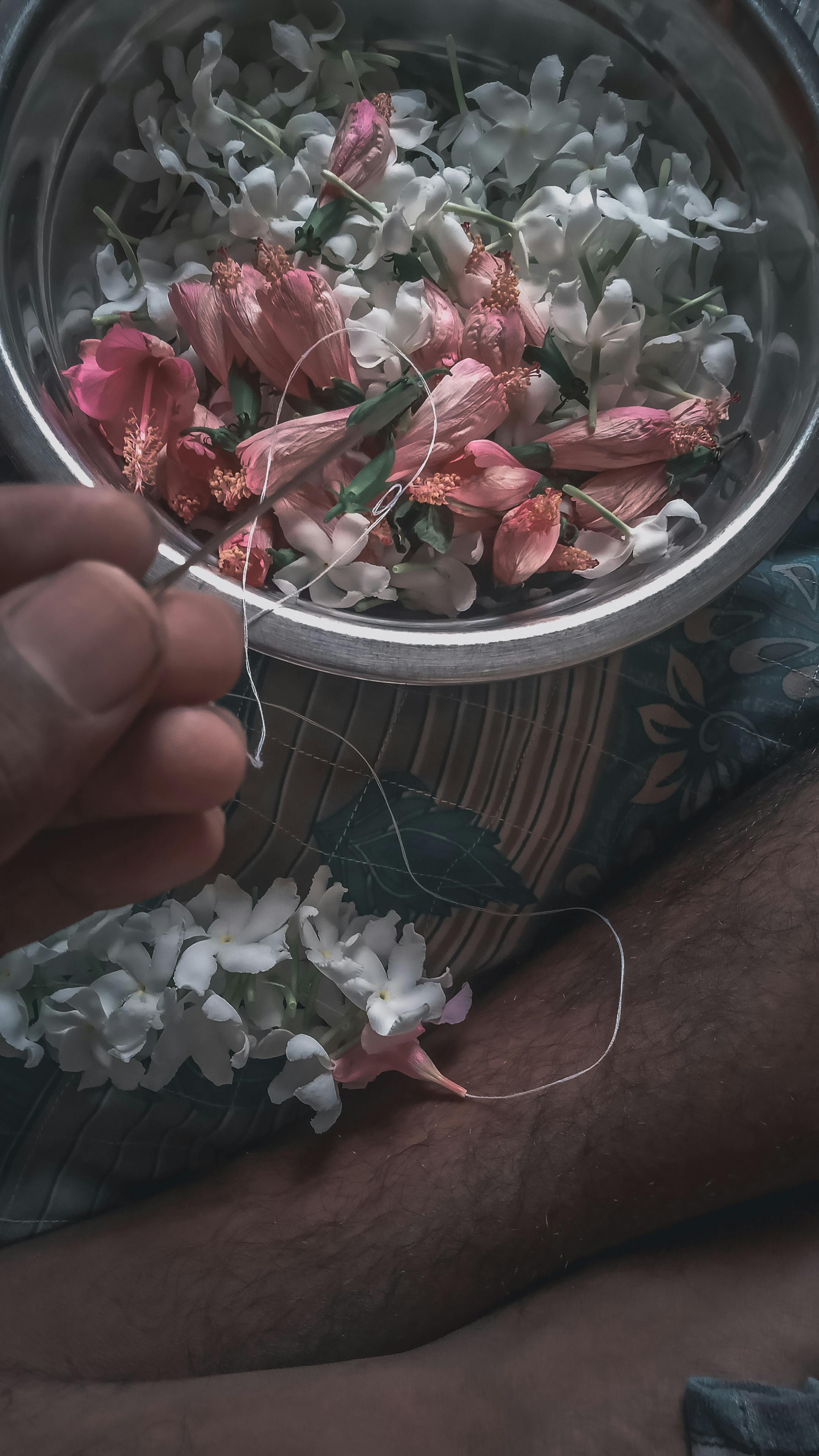 Person Putting Thread on Needle Close-Up Photo · Free Stock Photo