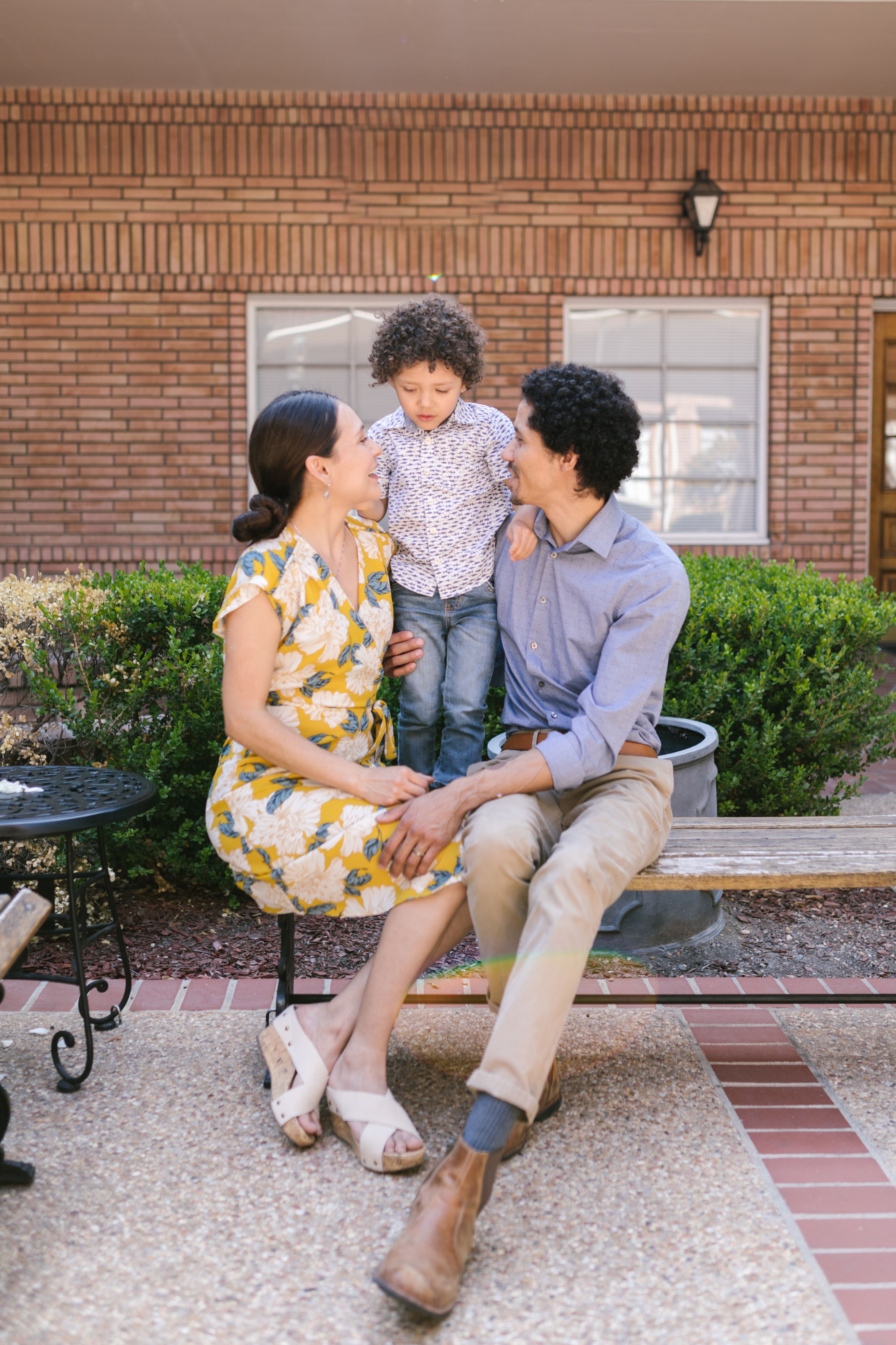 Group of Happy People Sitting on a Pavement · Free Stock Photo