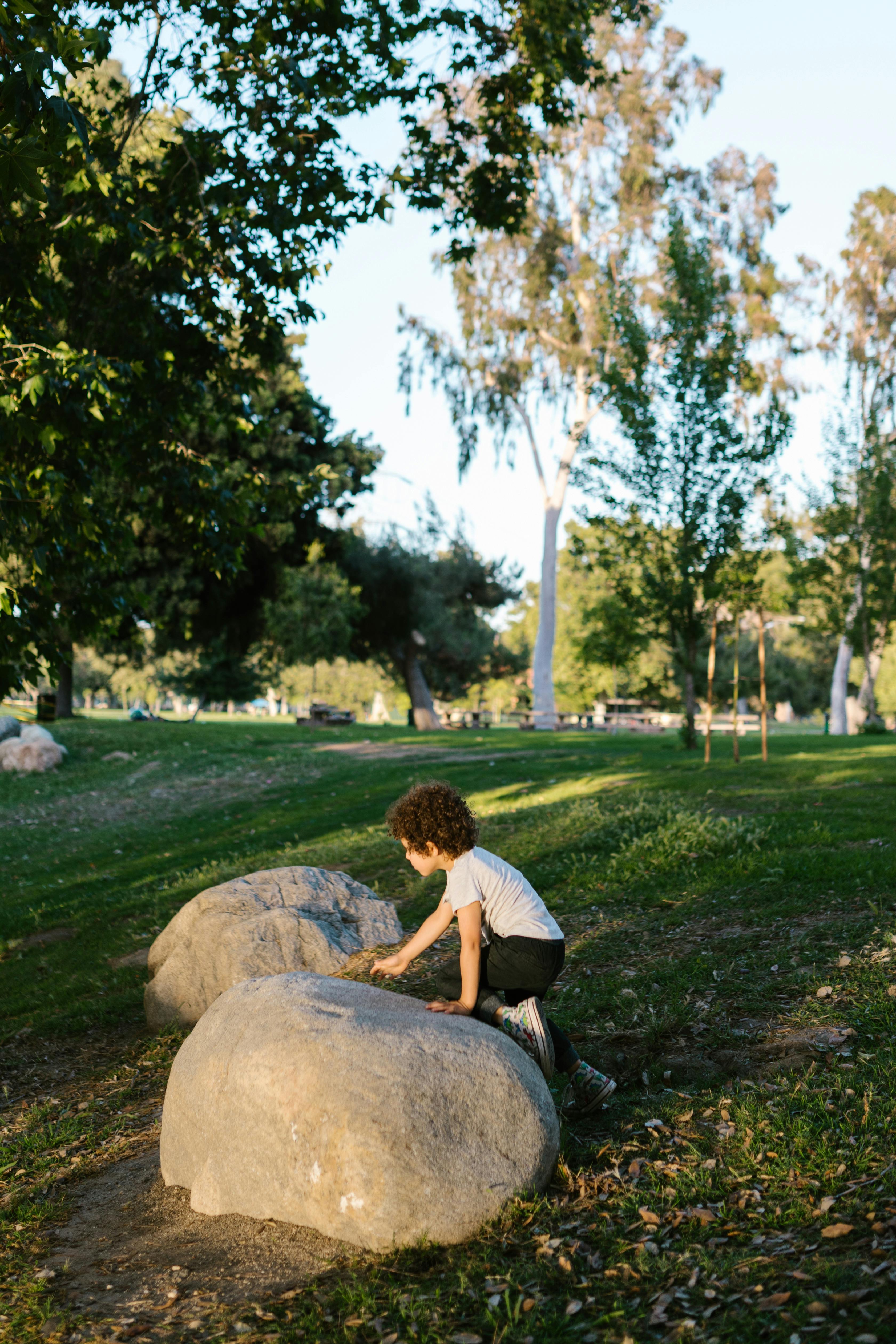 A Boy Walking on the Rock Formation · Free Stock Photo