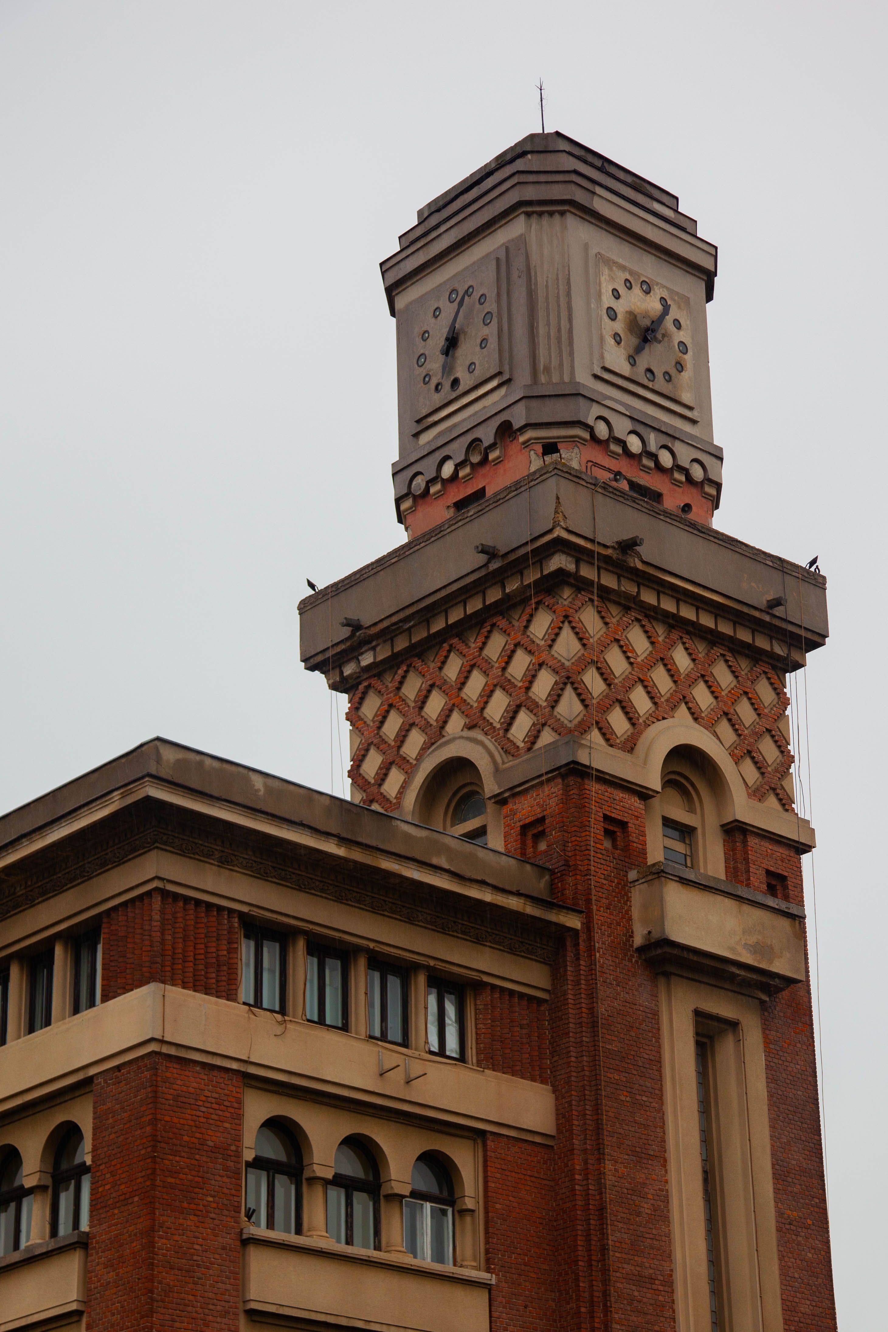 Photograph of a Brown Clock Tower · Free Stock Photo
