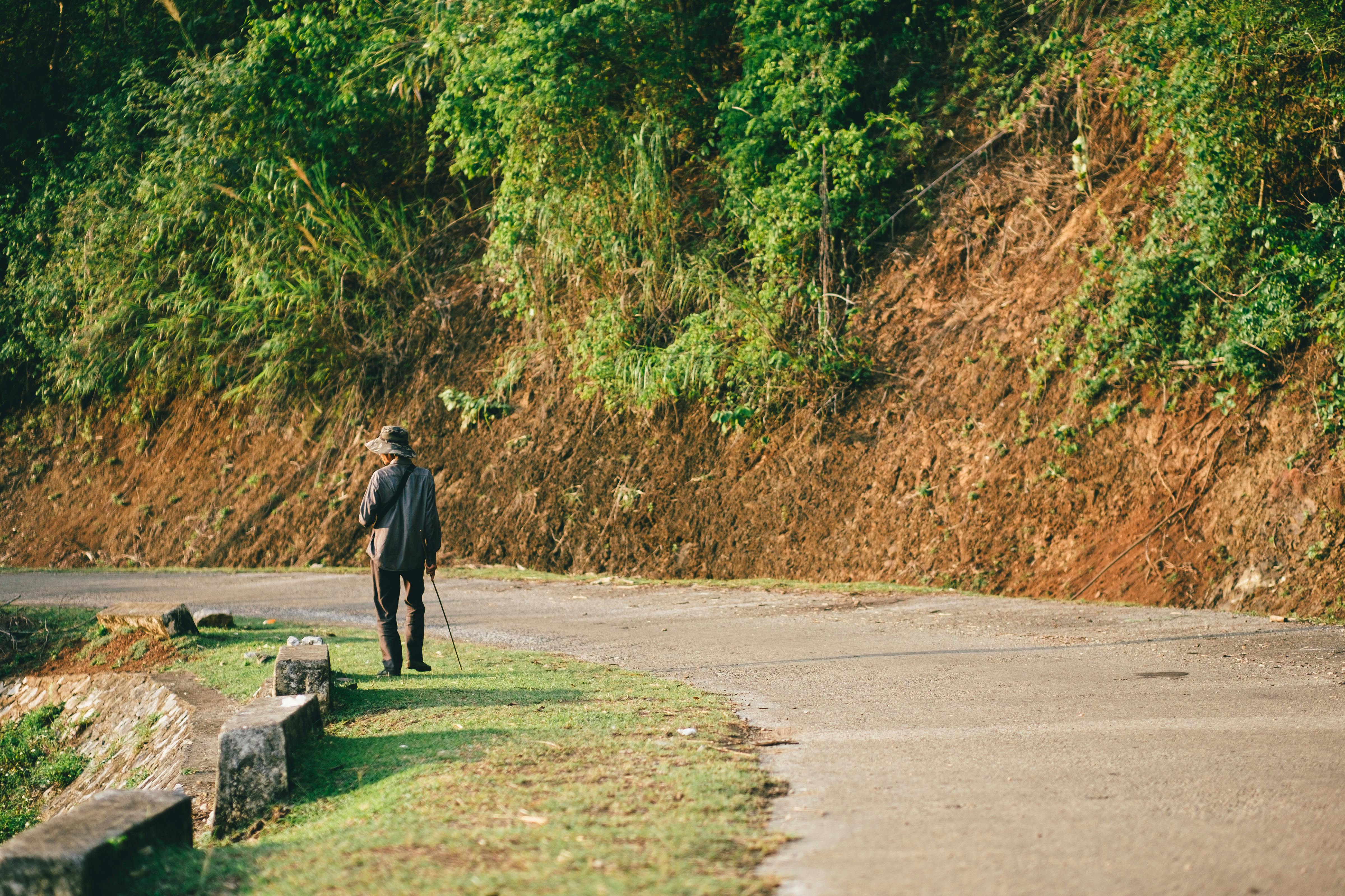 A Person Walking on the Road · Free Stock Photo