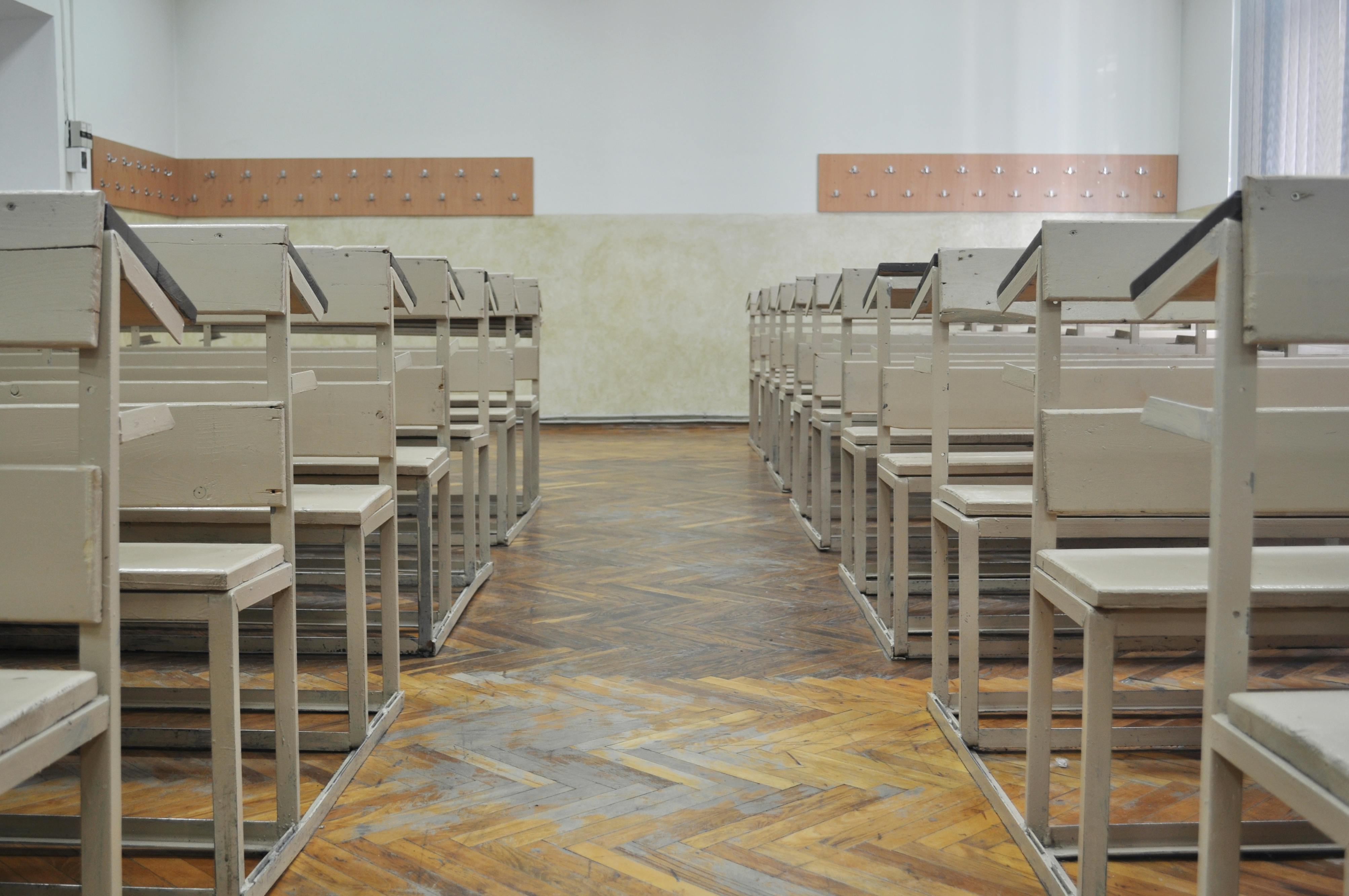 Empty Classroom with Beige Benches in Rows · Free Stock Photo