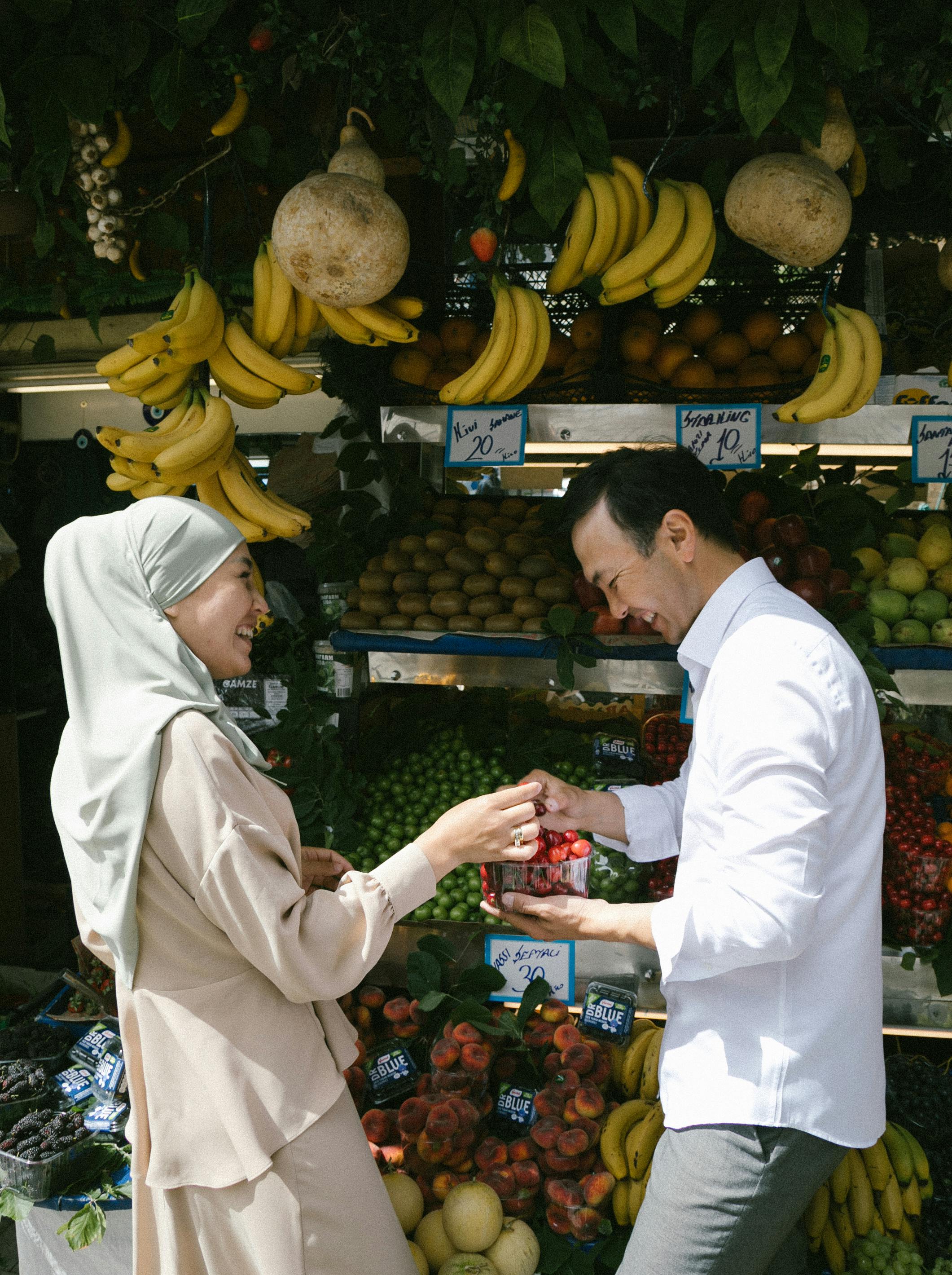 Woman and Man buying Fruits at a Market · Free Stock Photo