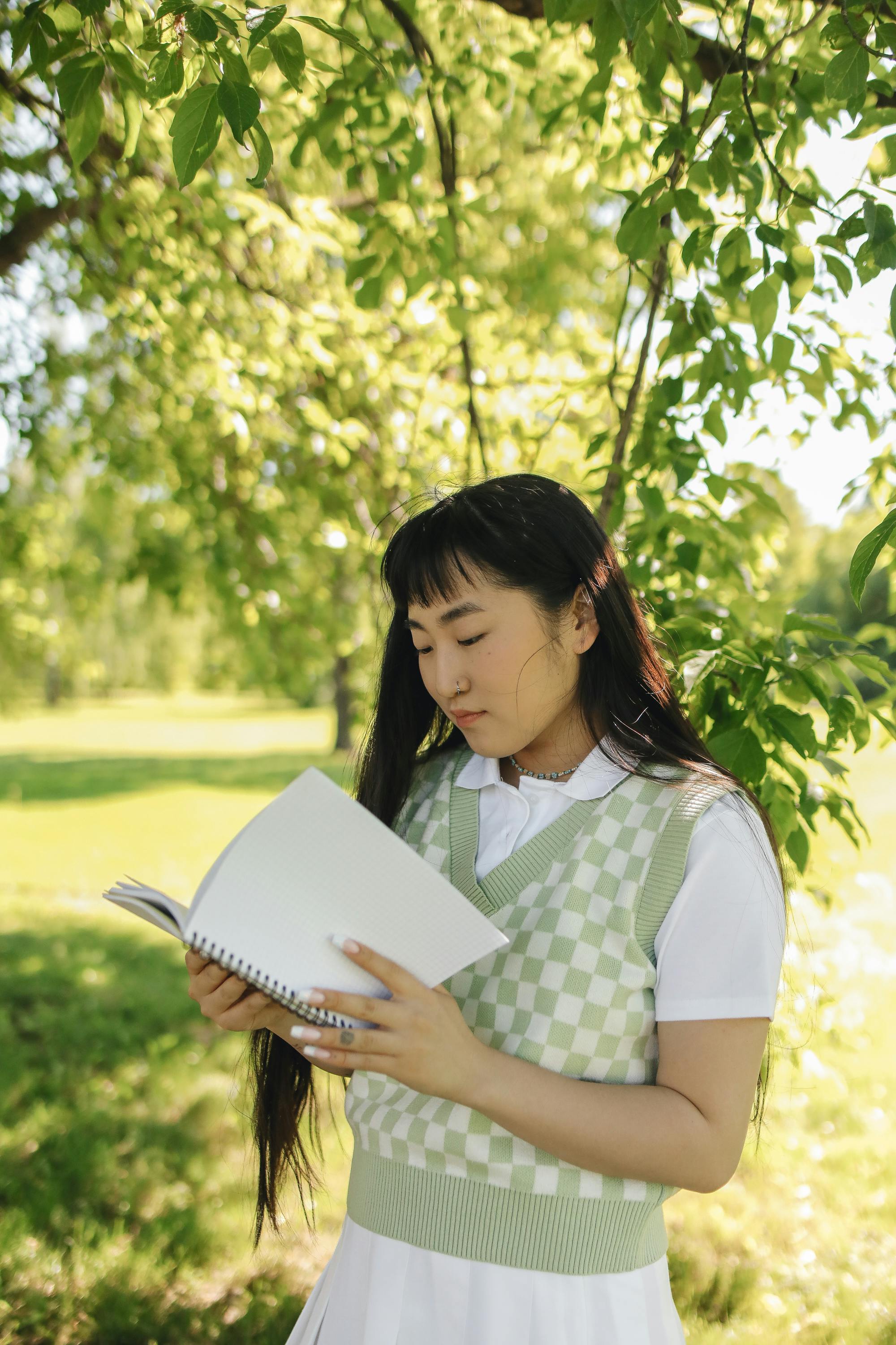 A Student Reading Her Notebook · Free Stock Photo