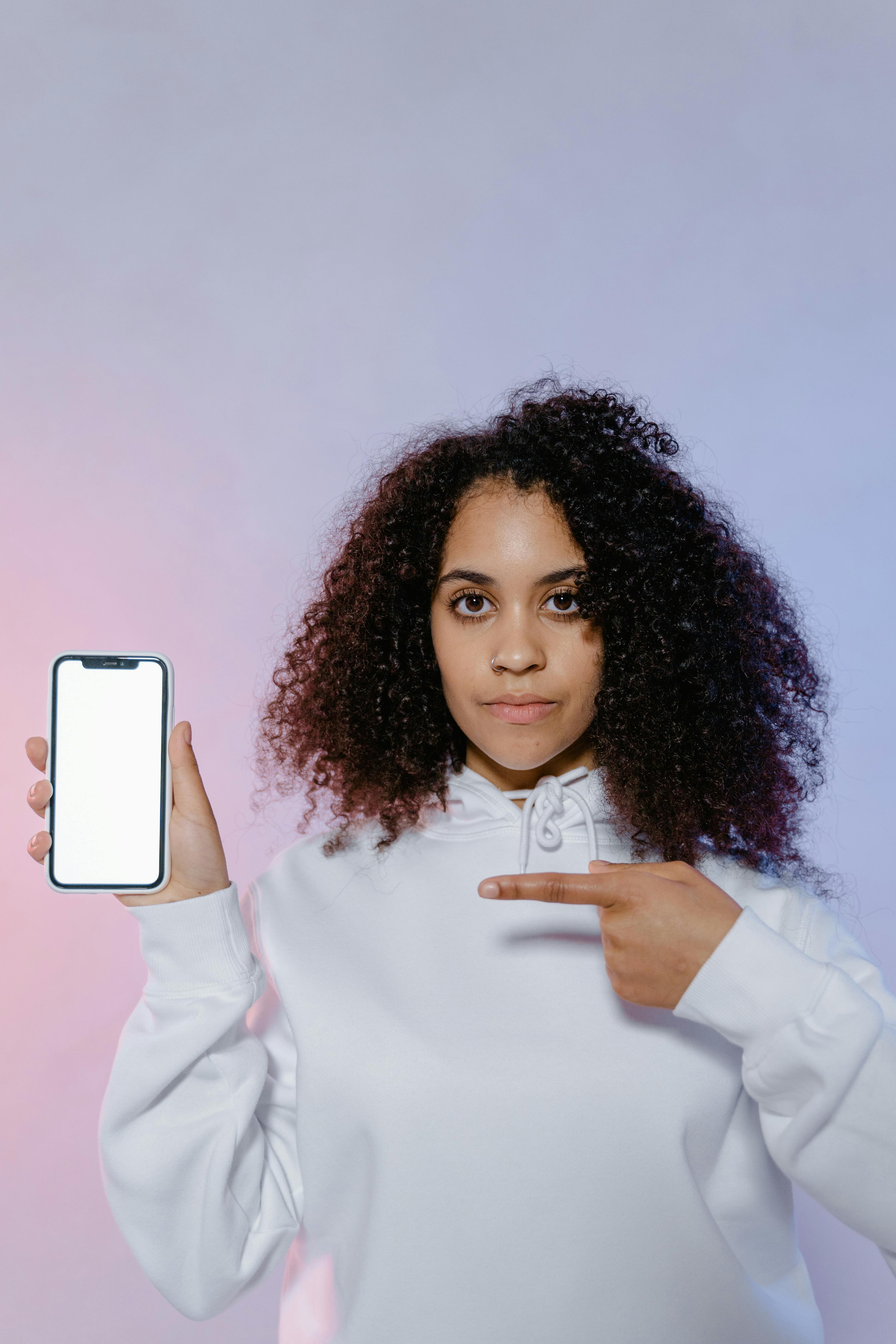 Mockup with Woman Holding Phone · Free Stock Photo