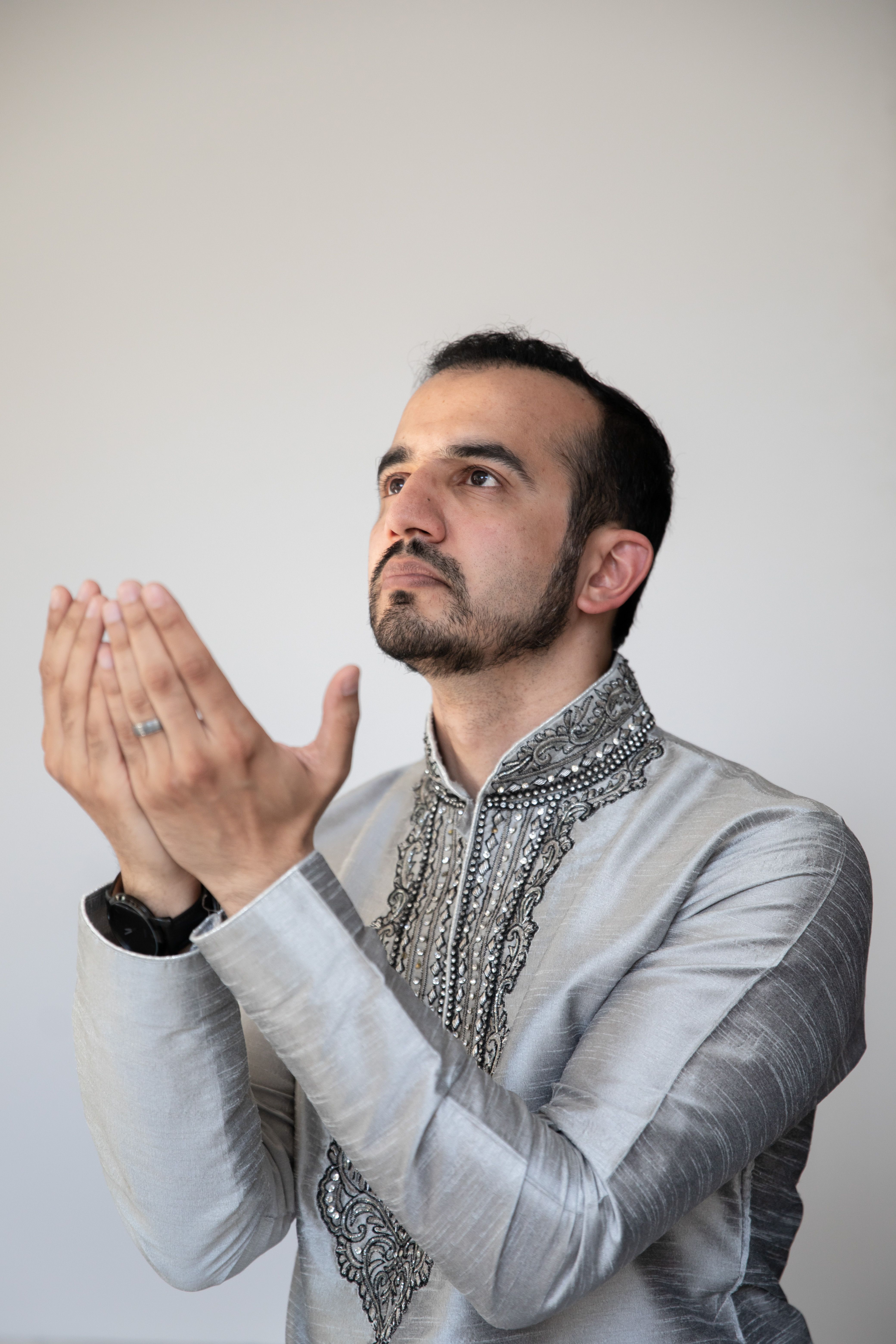 Man Wearing Traditional Clothes Praying · Free Stock Photo