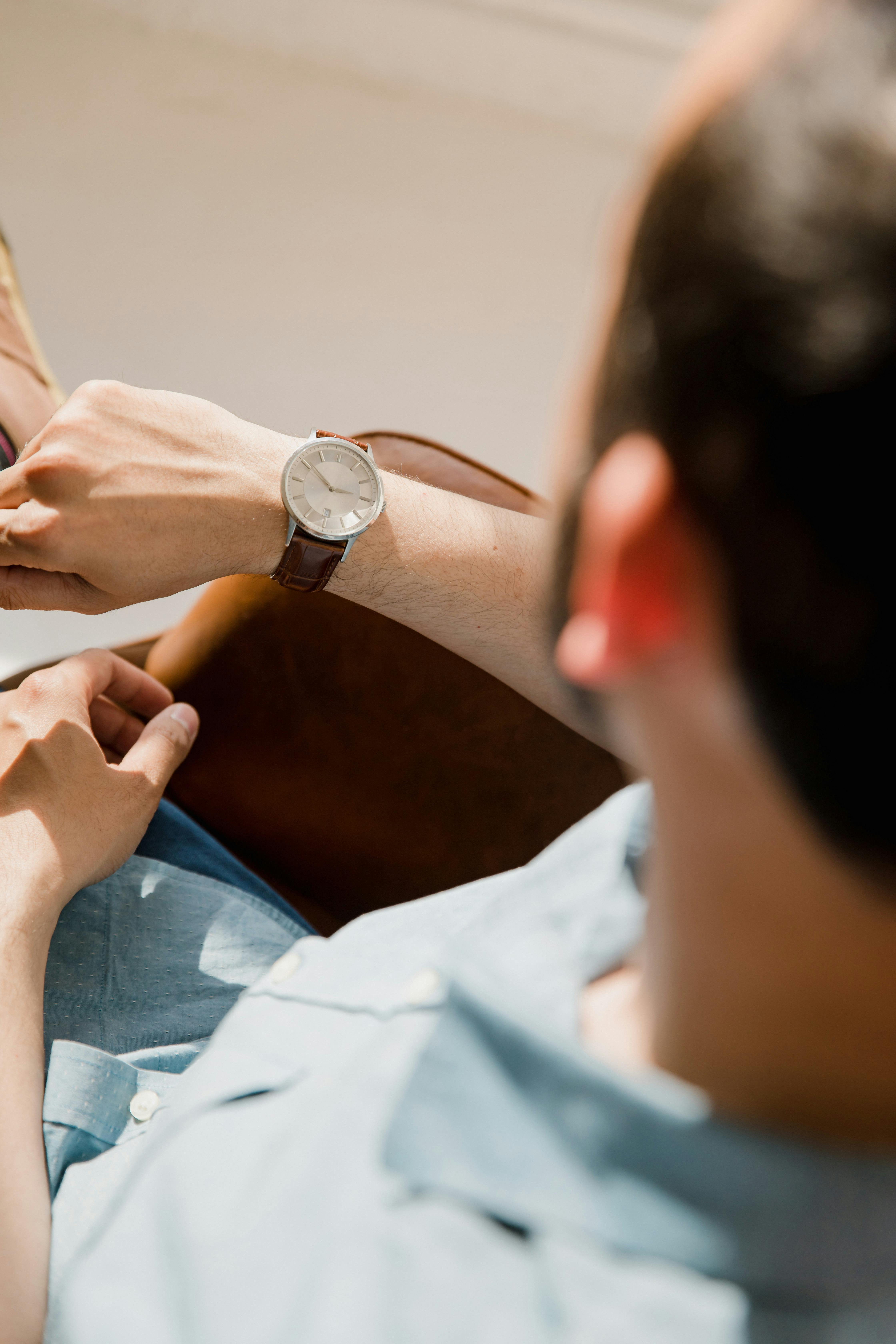 Selective Focus Photography of Person Watching Watch · Free Stock Photo