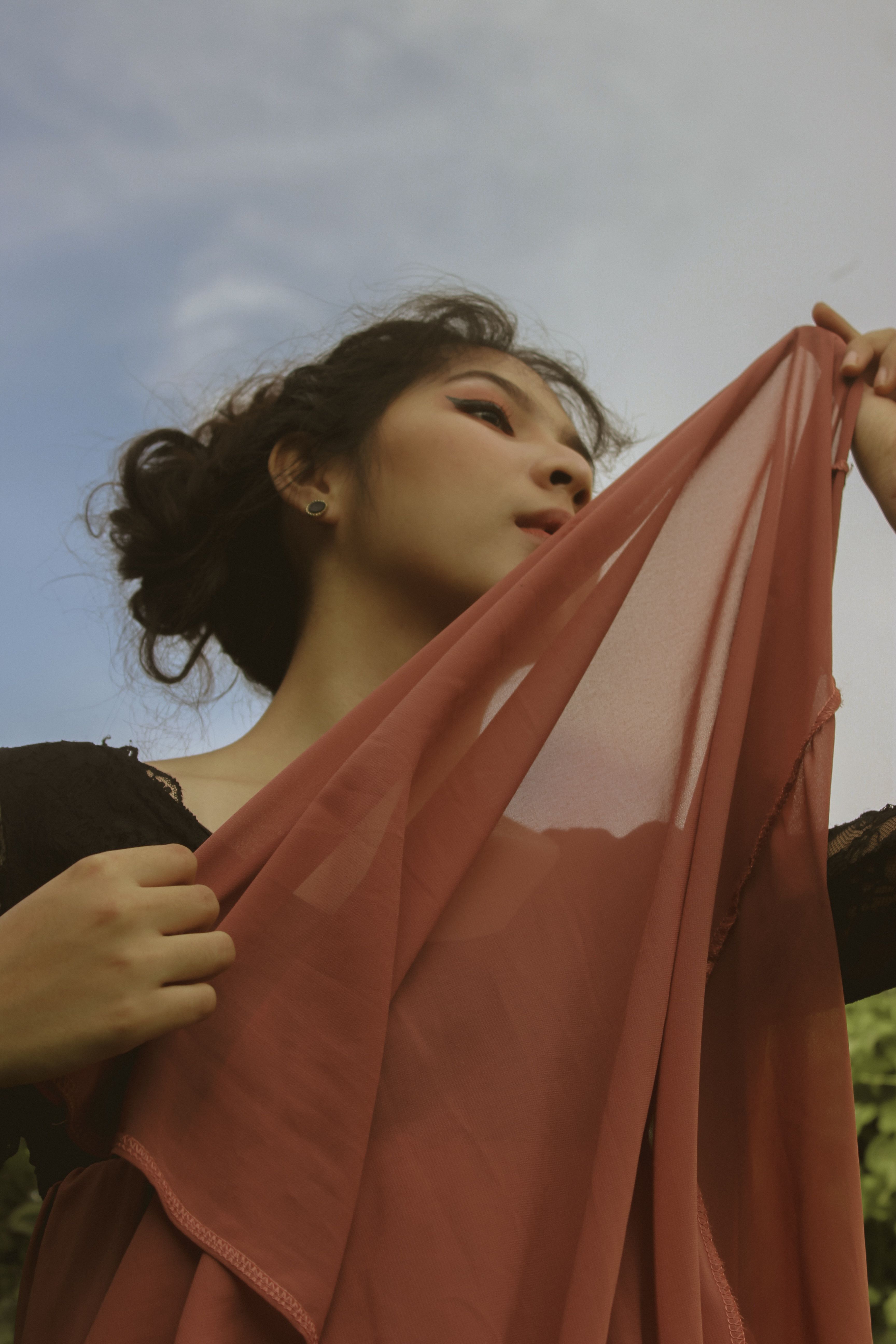 Person Holding a Sheer Fabric · Free Stock Photo