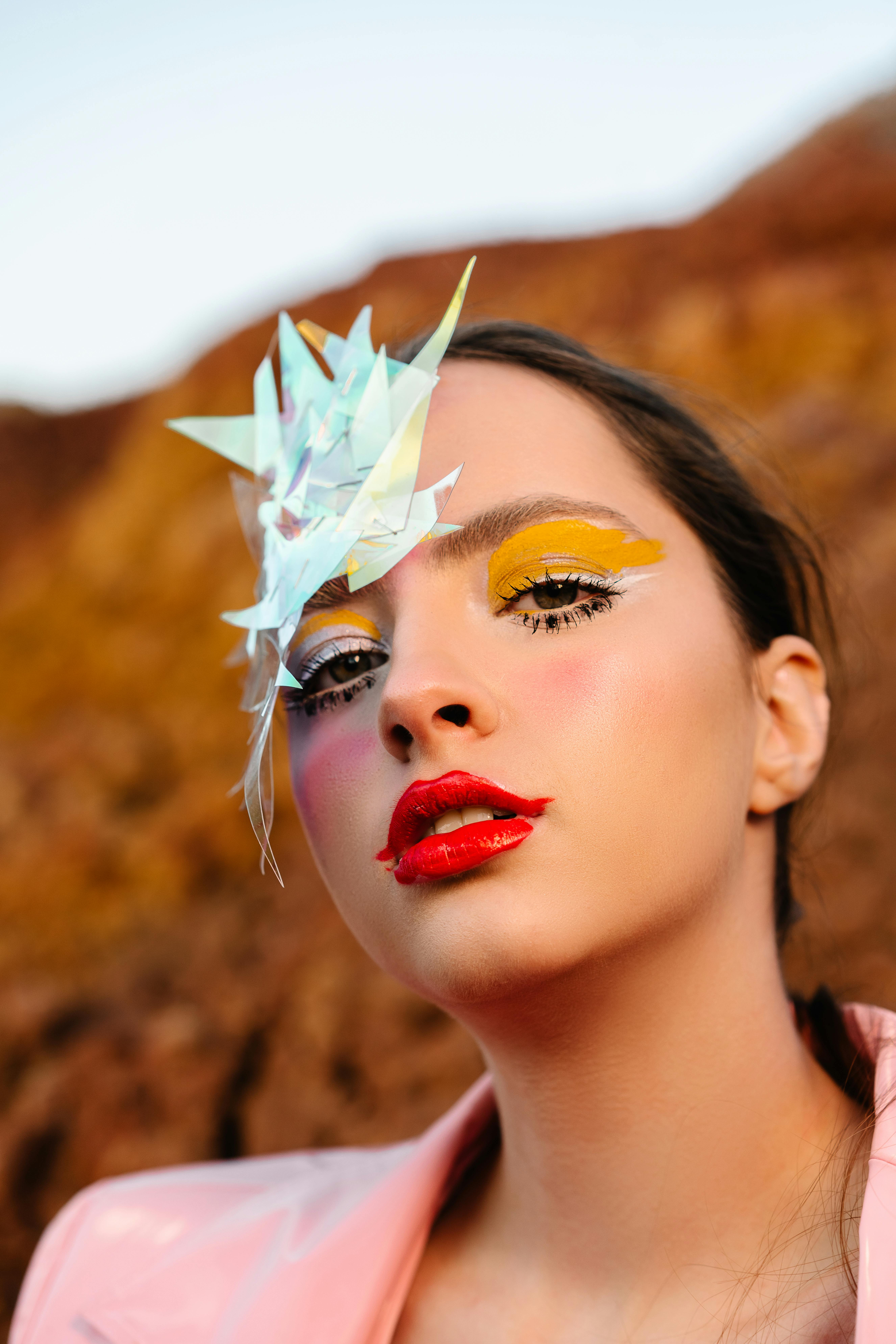 A Portrait of a Woman Wearing Makeup and Pieces of Plastic on Her Face ...