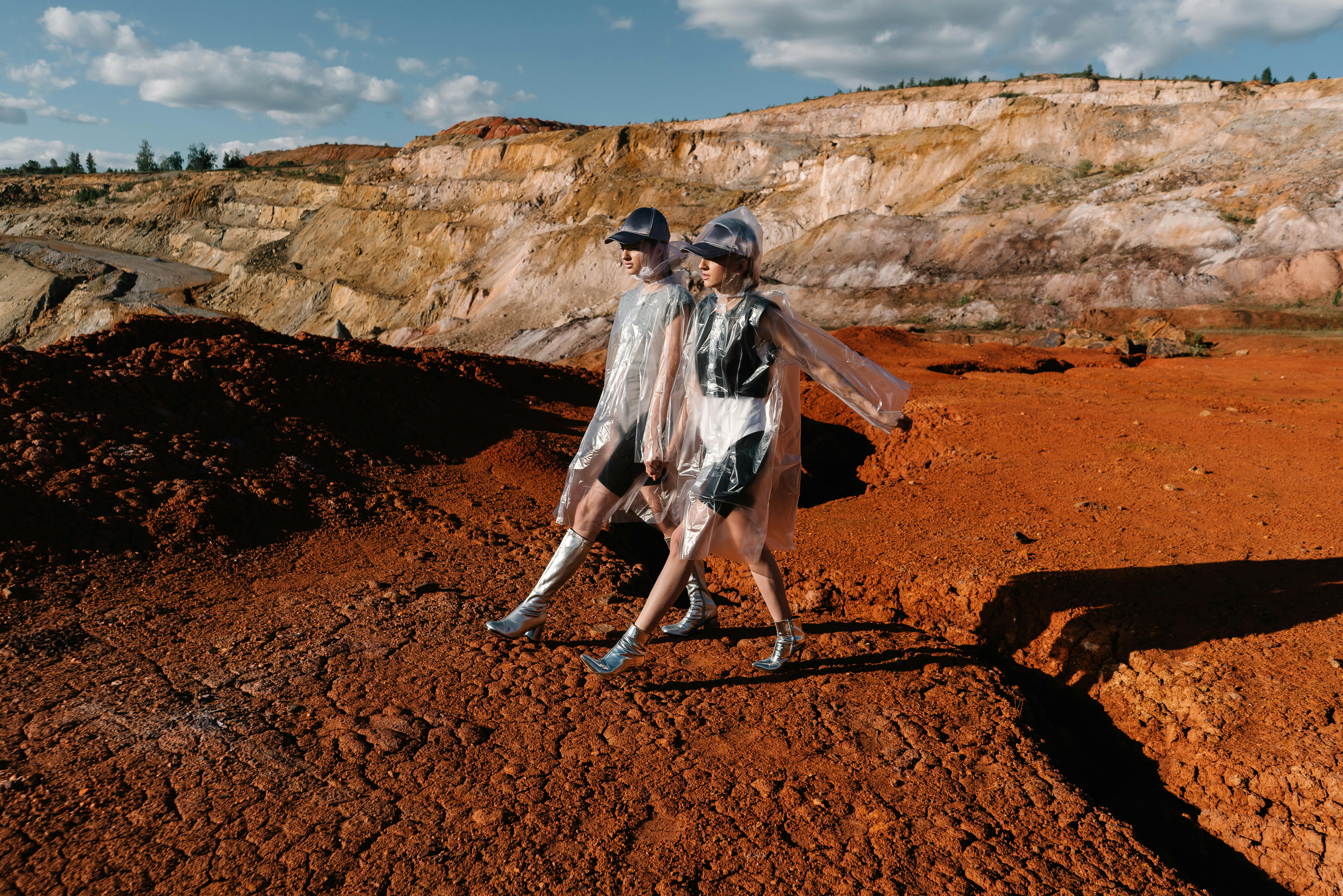 Women in Transparent Raincoats Walking while Holding Hands · Free Stock ...