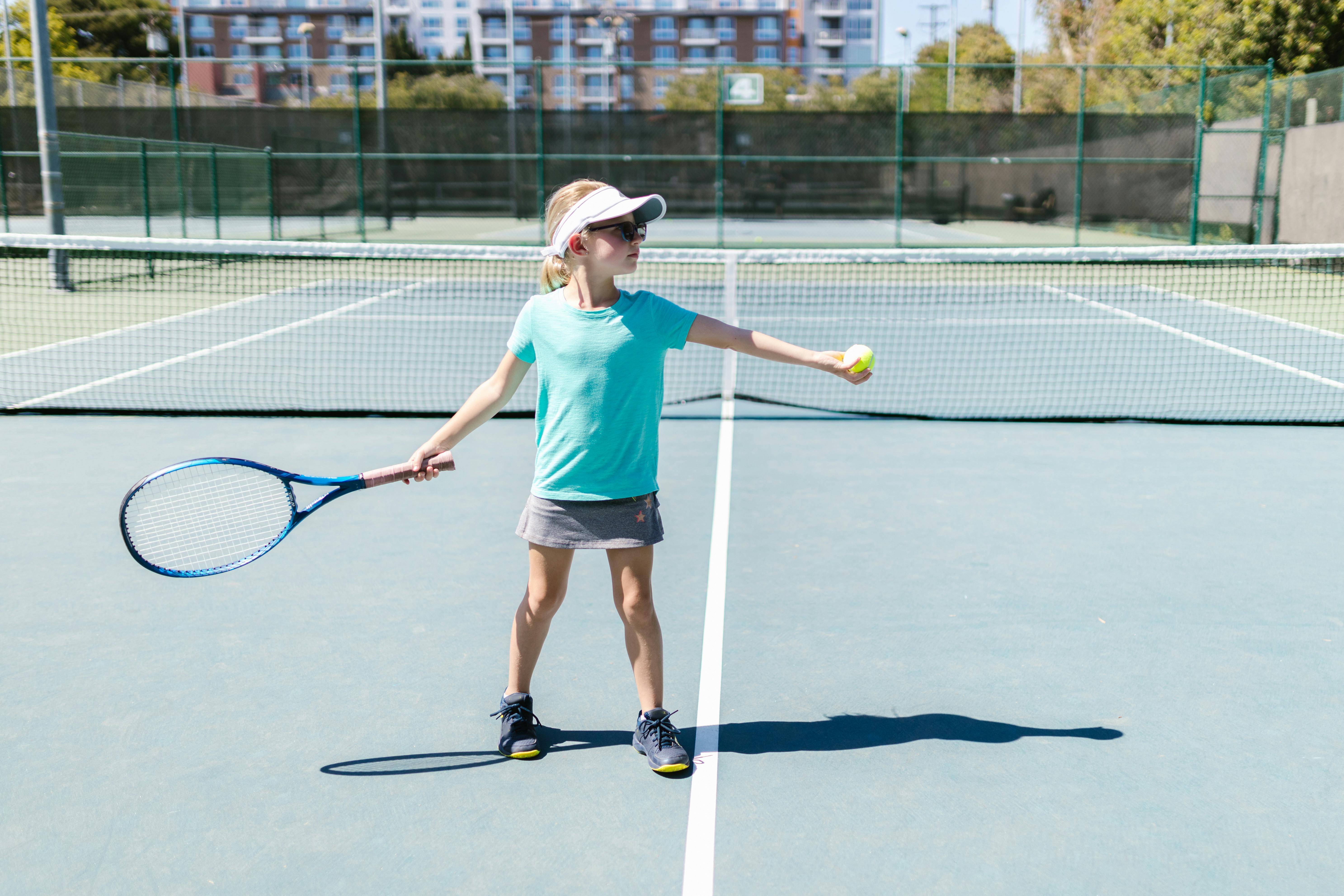Woman in Orange Sports Wear Doing Cartwheel · Free Stock Photo