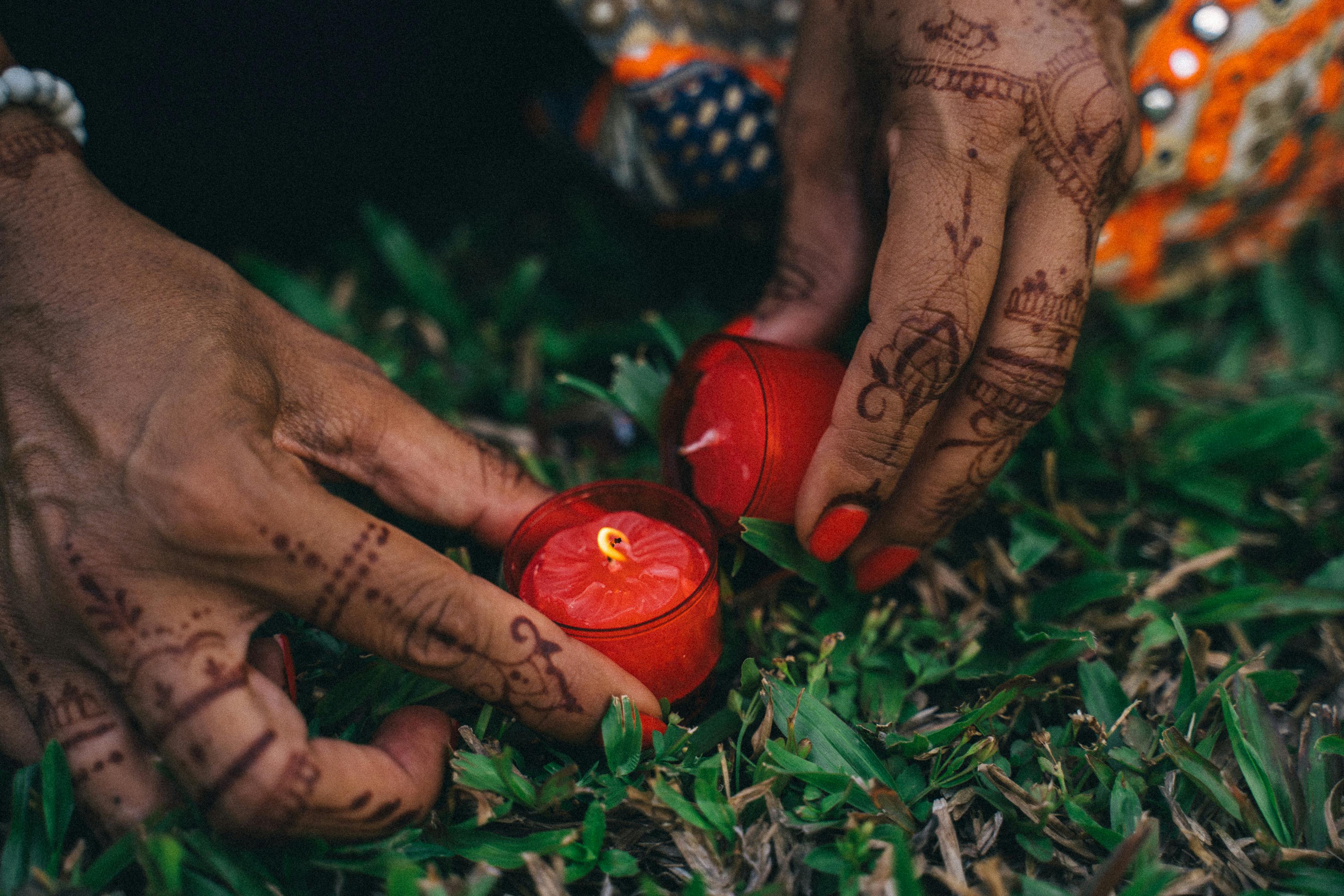 A Person Holding Lit Candles · Free Stock Photo