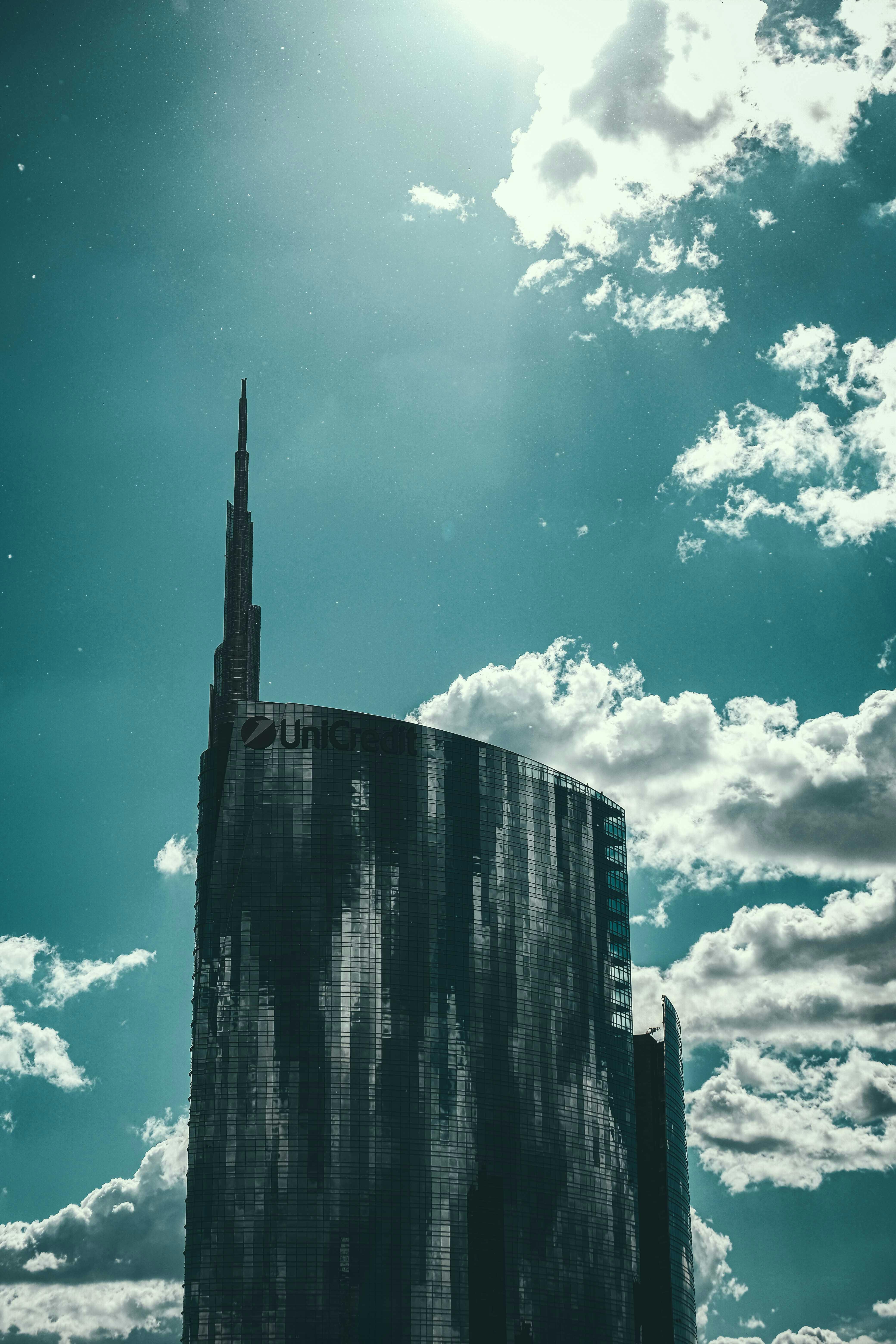A Tall Building under a Cloudy Sky · Free Stock Photo