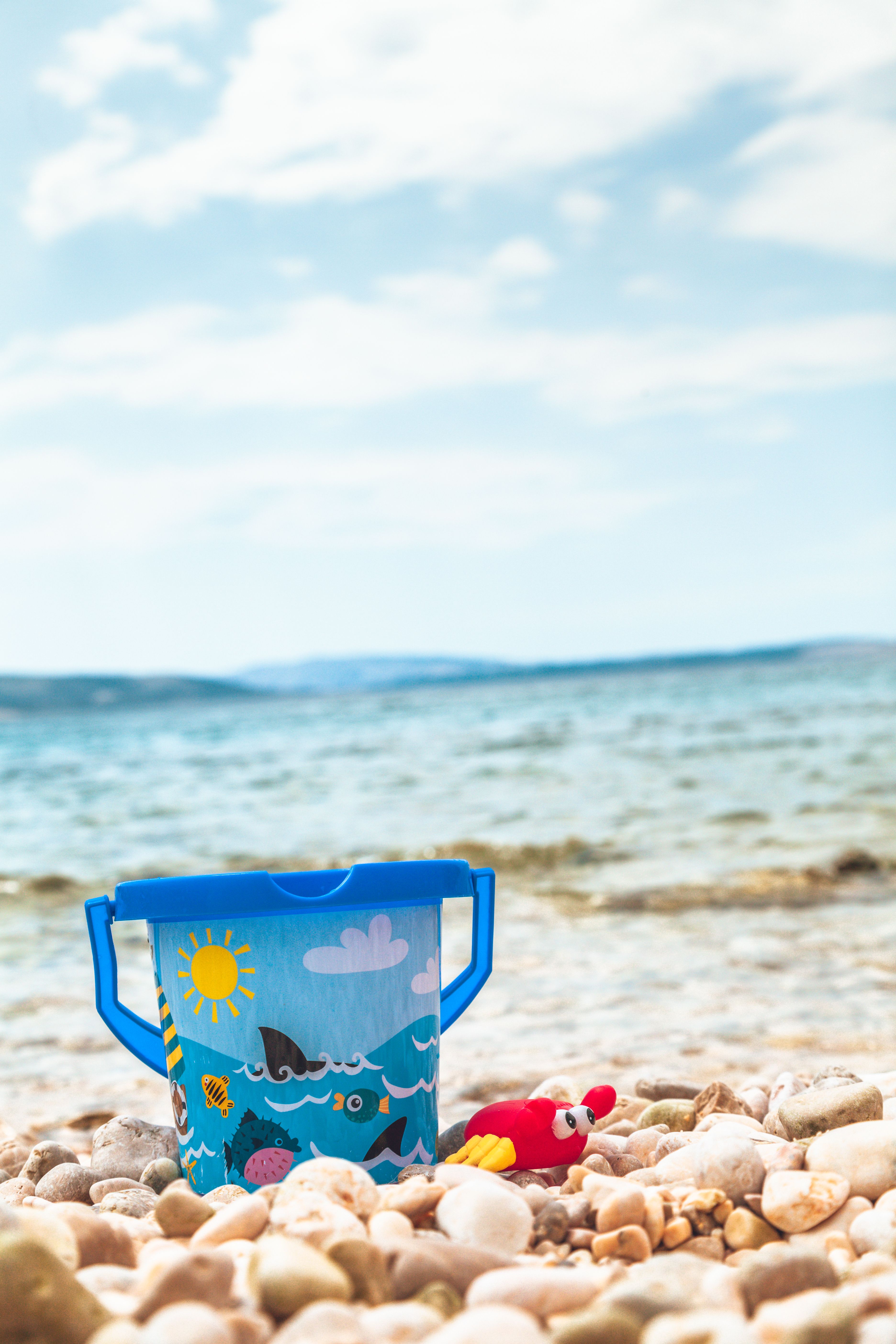 Close-Up Shot of a Beach Bucket on a Beach · Free Stock Photo