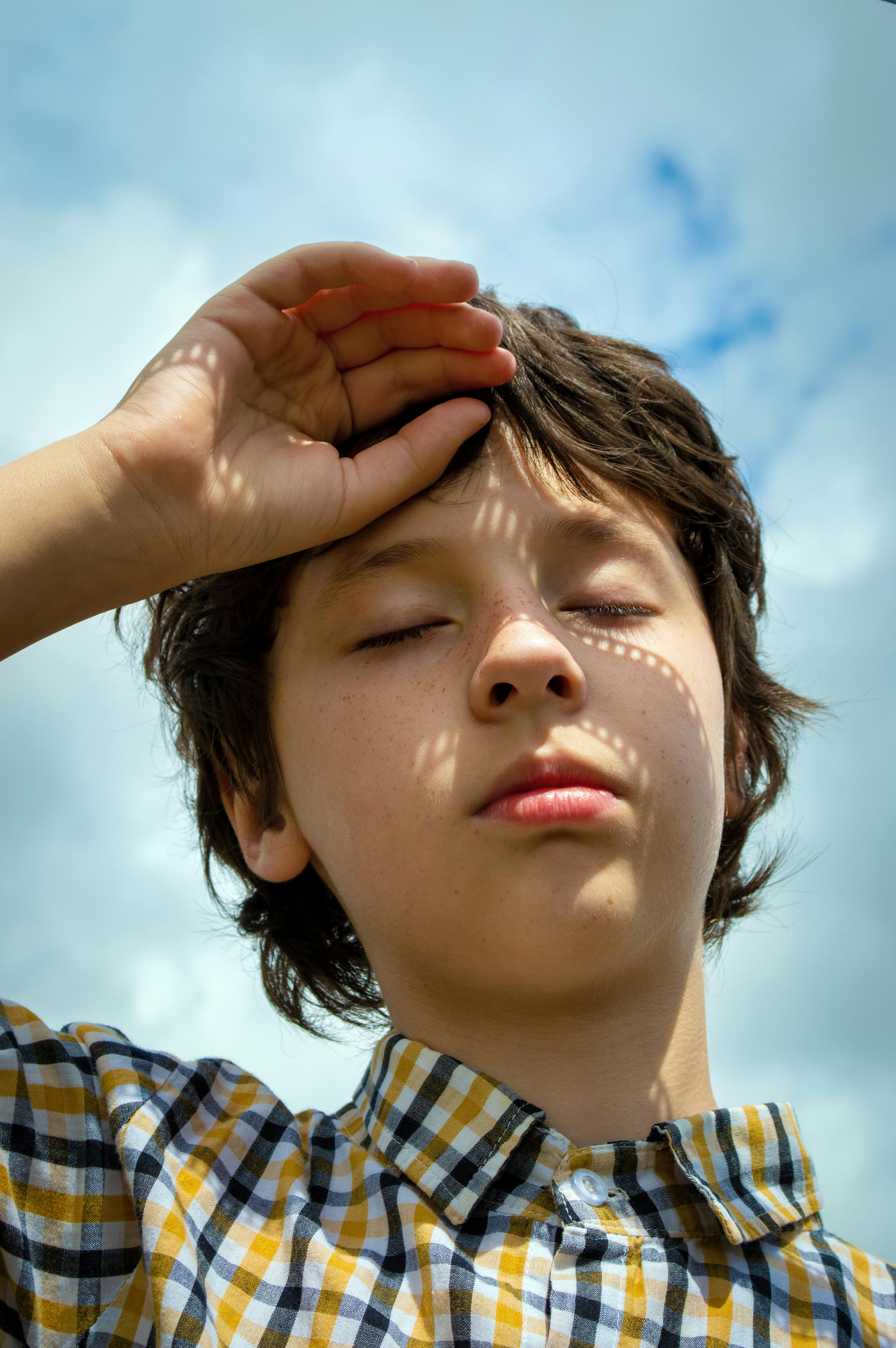 Boy with Eyes Closed · Free Stock Photo