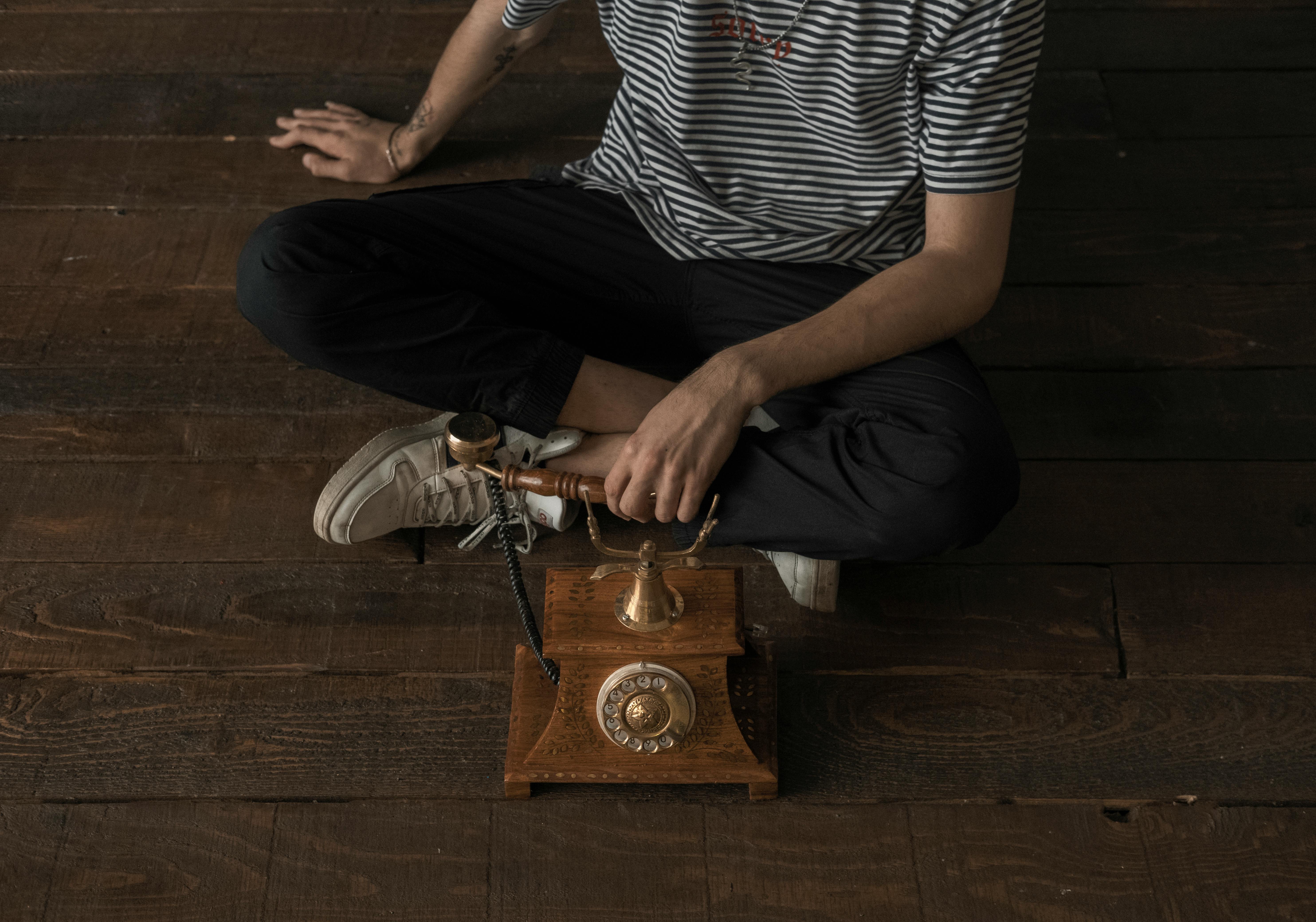 Person Holding Vintage Phone · Free Stock Photo