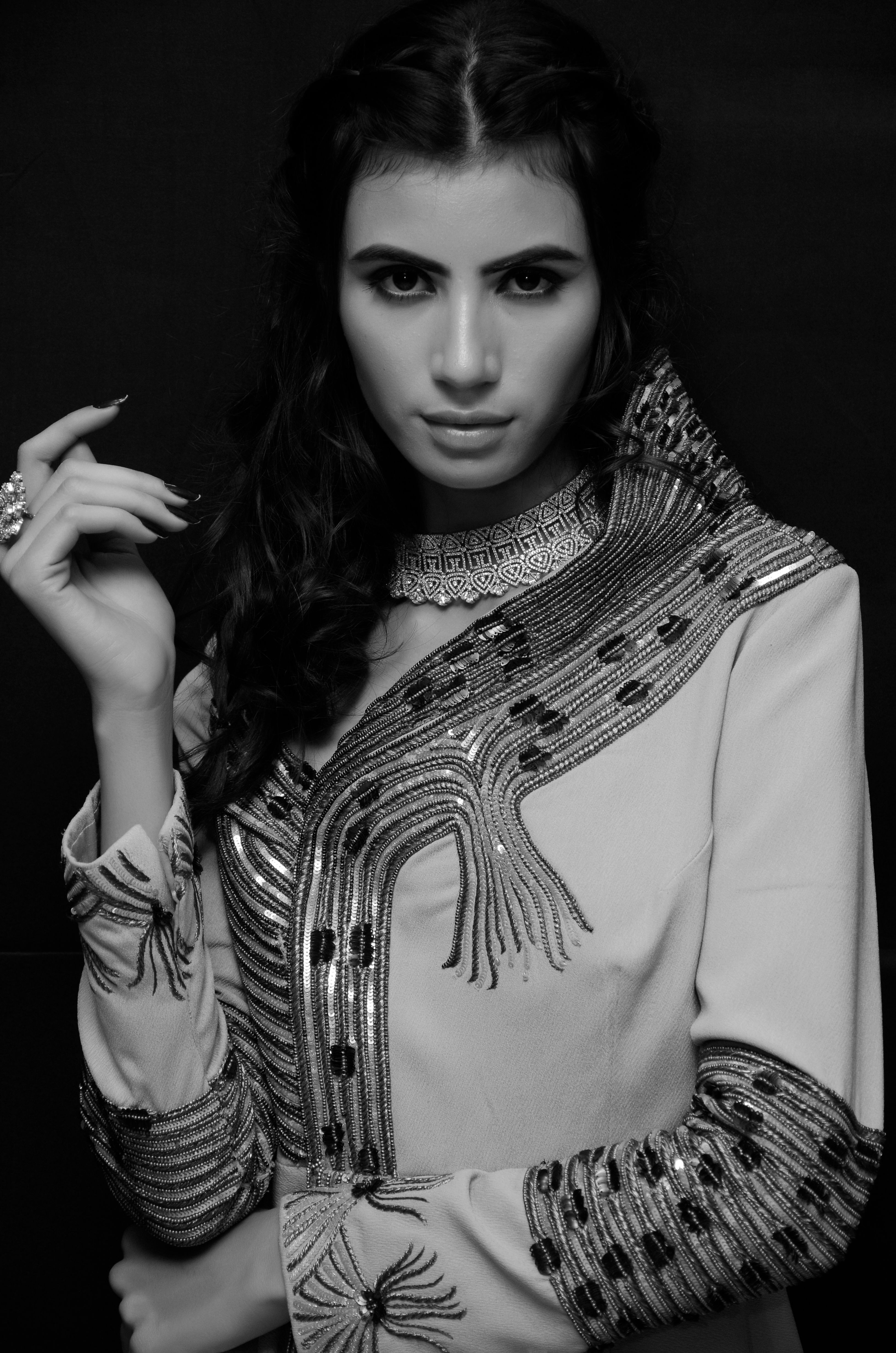 A Woman Wearing a Dress with Intricate Designs · Free Stock Photo