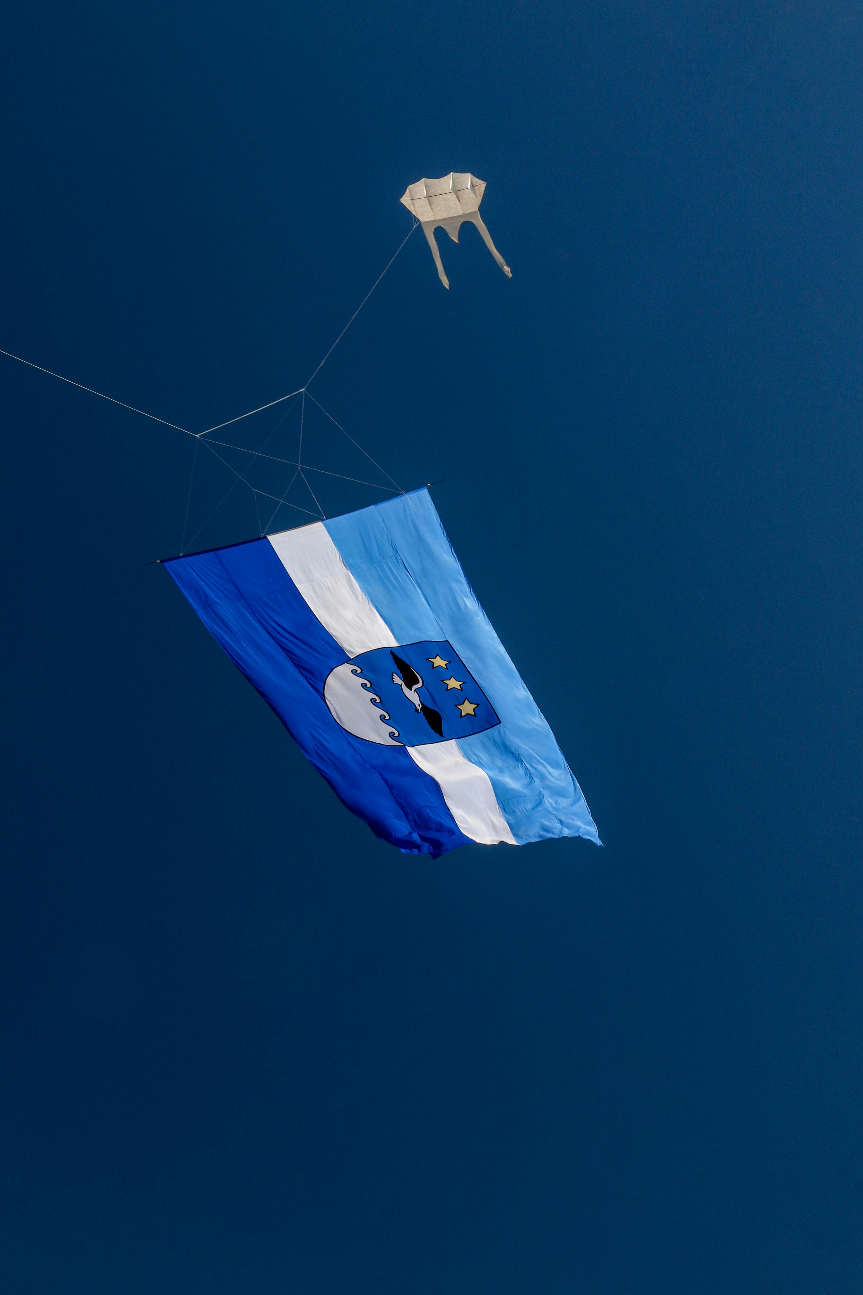 Flag Flying in Blue Sky · Free Stock Photo