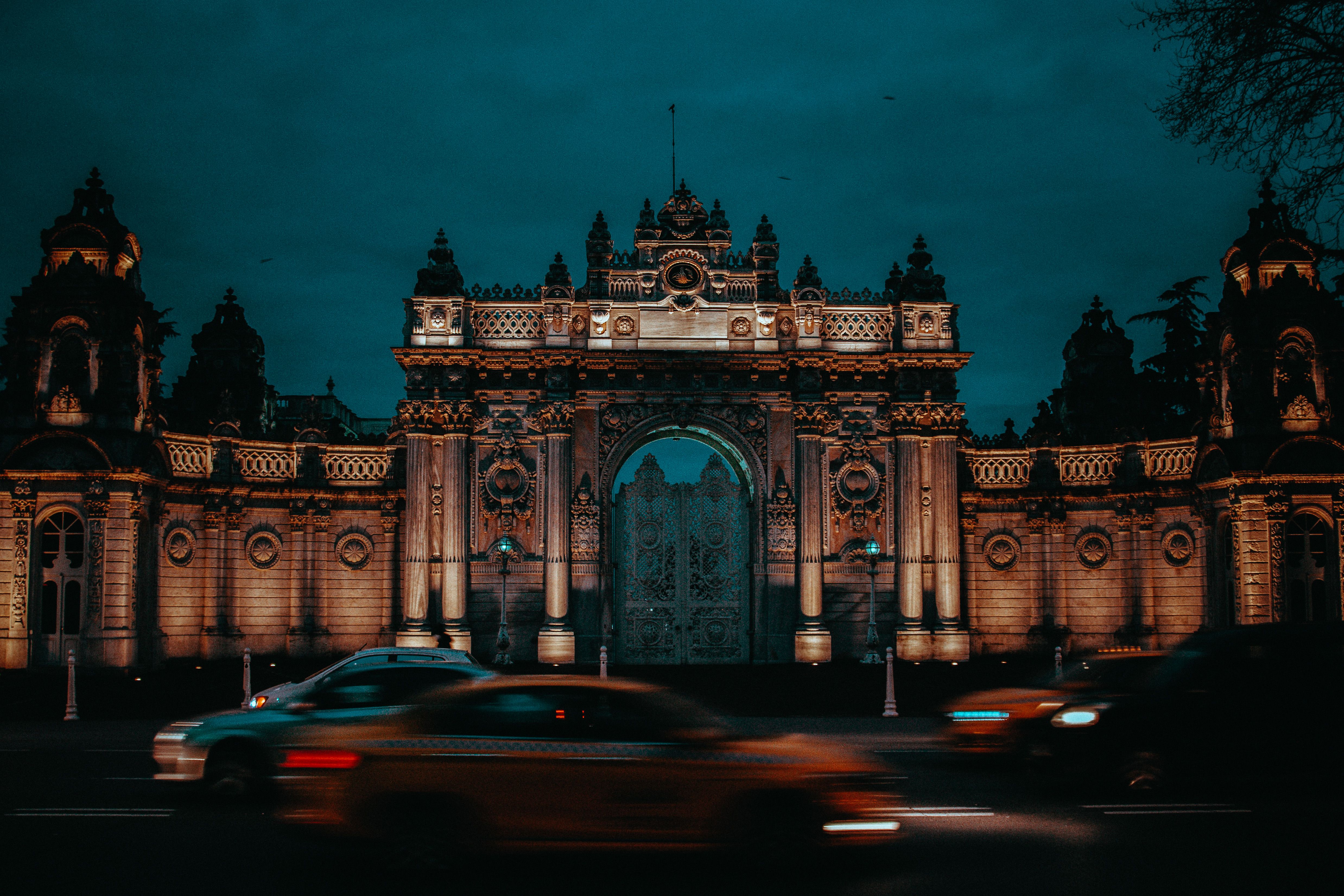 Illuminated Ornate Stone Entrance · Free Stock Photo