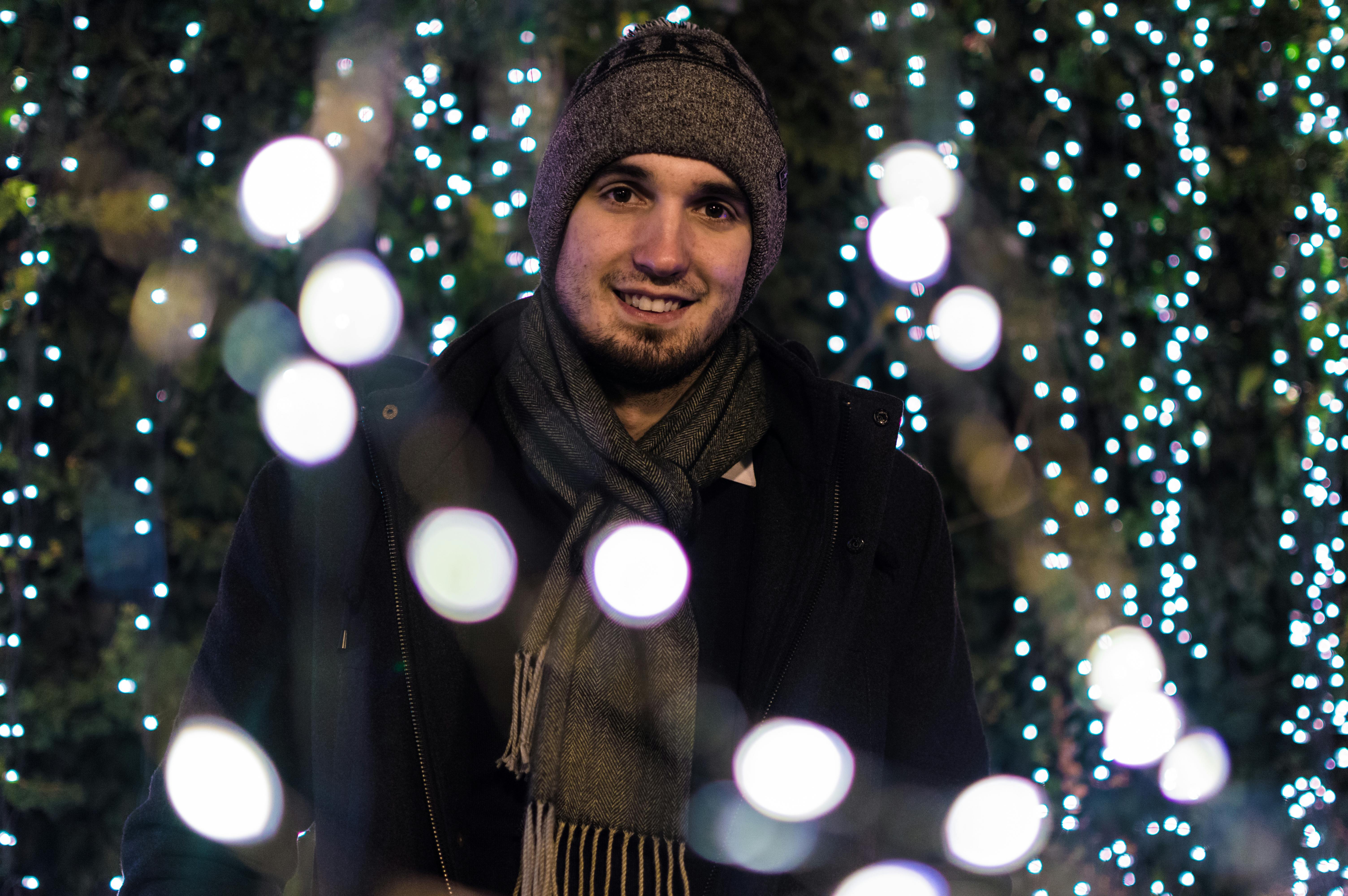 Man Wearing Snow Coat With Bokeh Light Background · Free Stock Photo