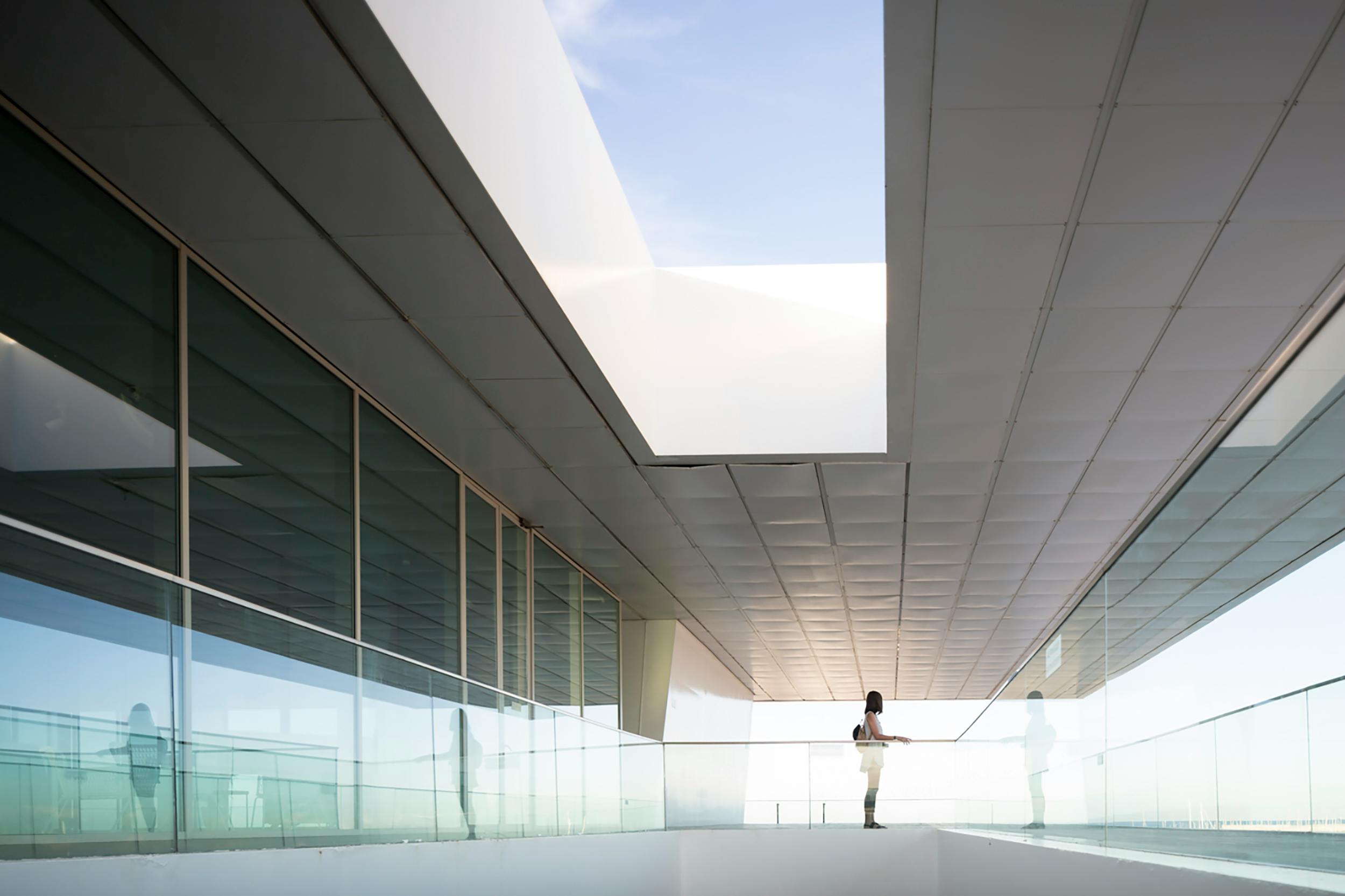Woman Standing on a Modern Terrace · Free Stock Photo