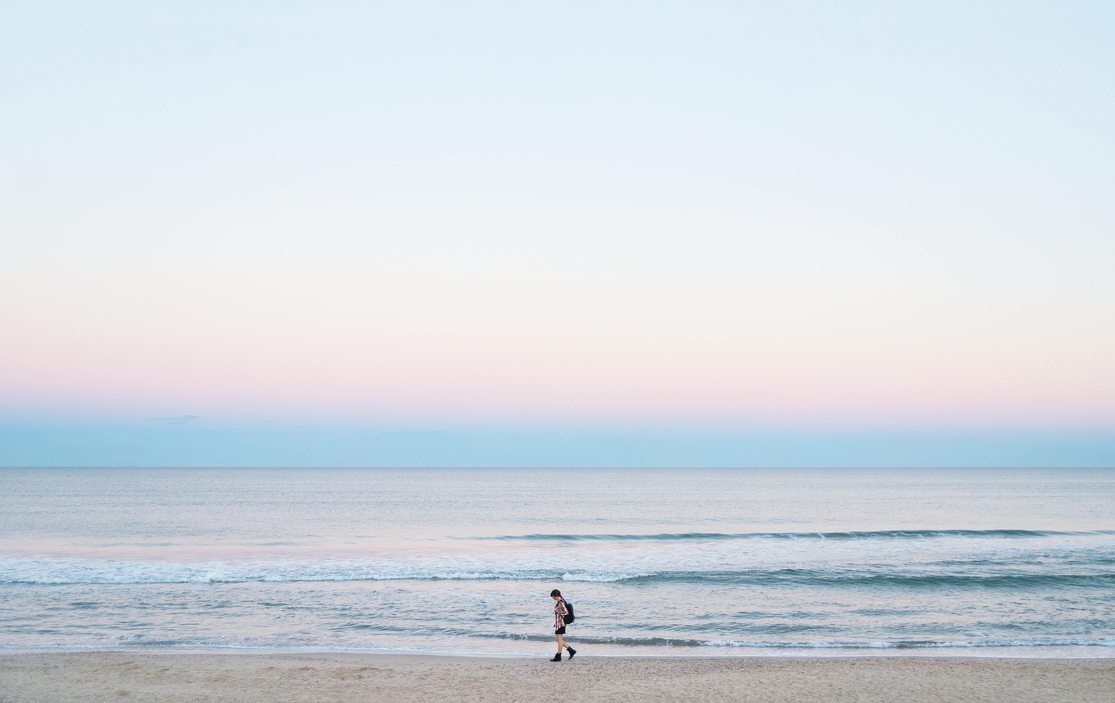 Person Walking on Beach · Free Stock Photo