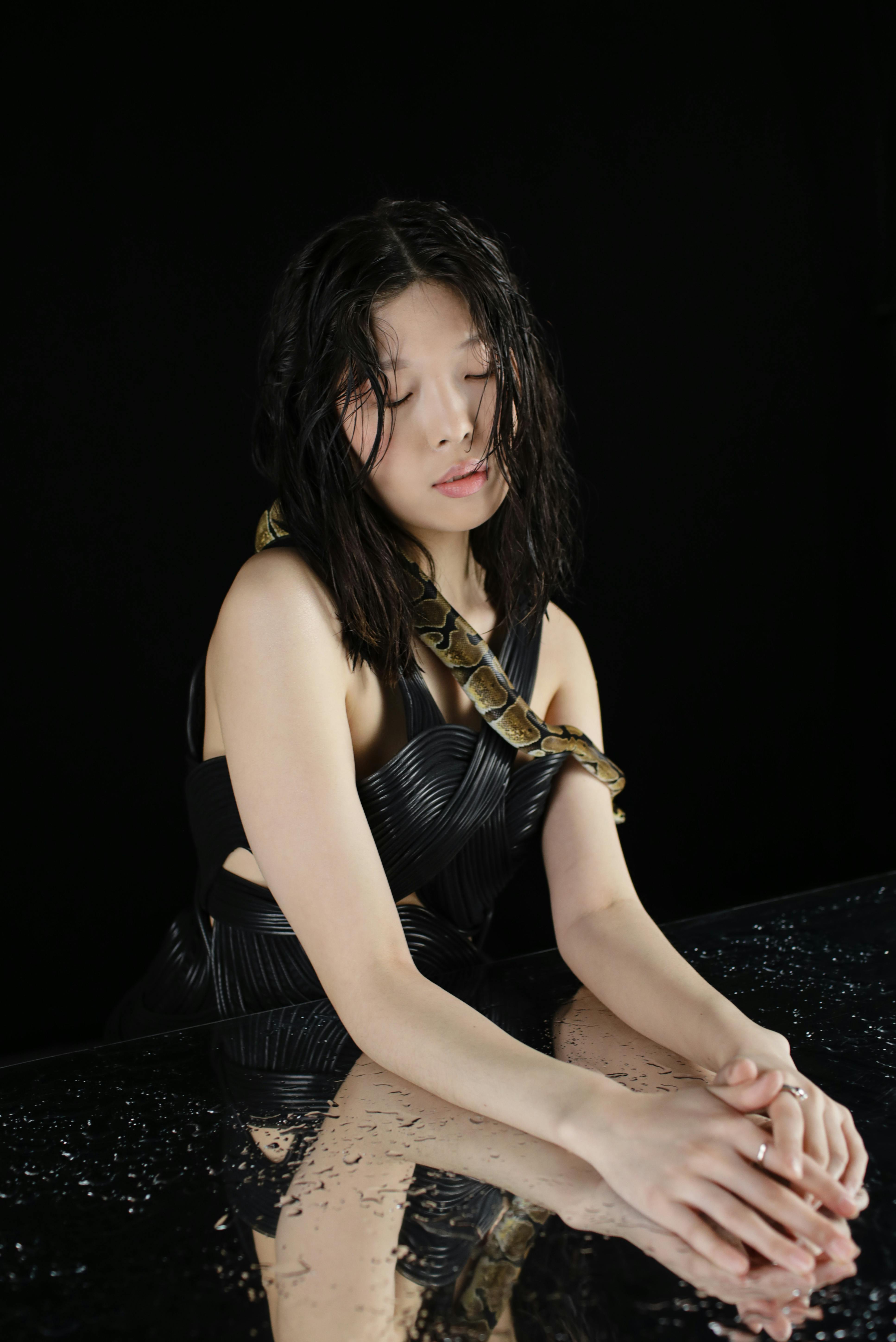 Woman Posing with a Snake on Her Shoulder · Free Stock Photo