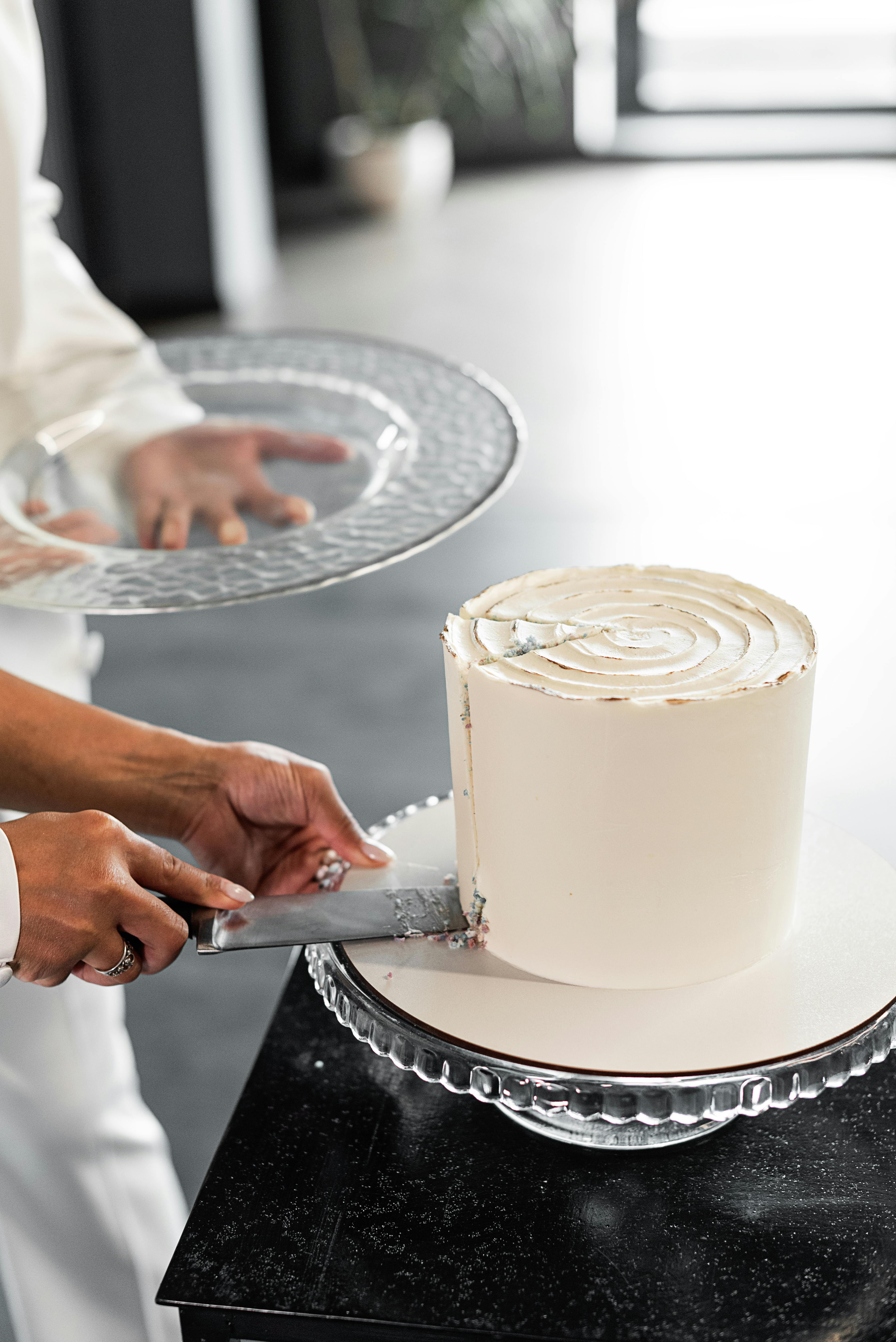Hand Slicing a Cake · Free Stock Photo
