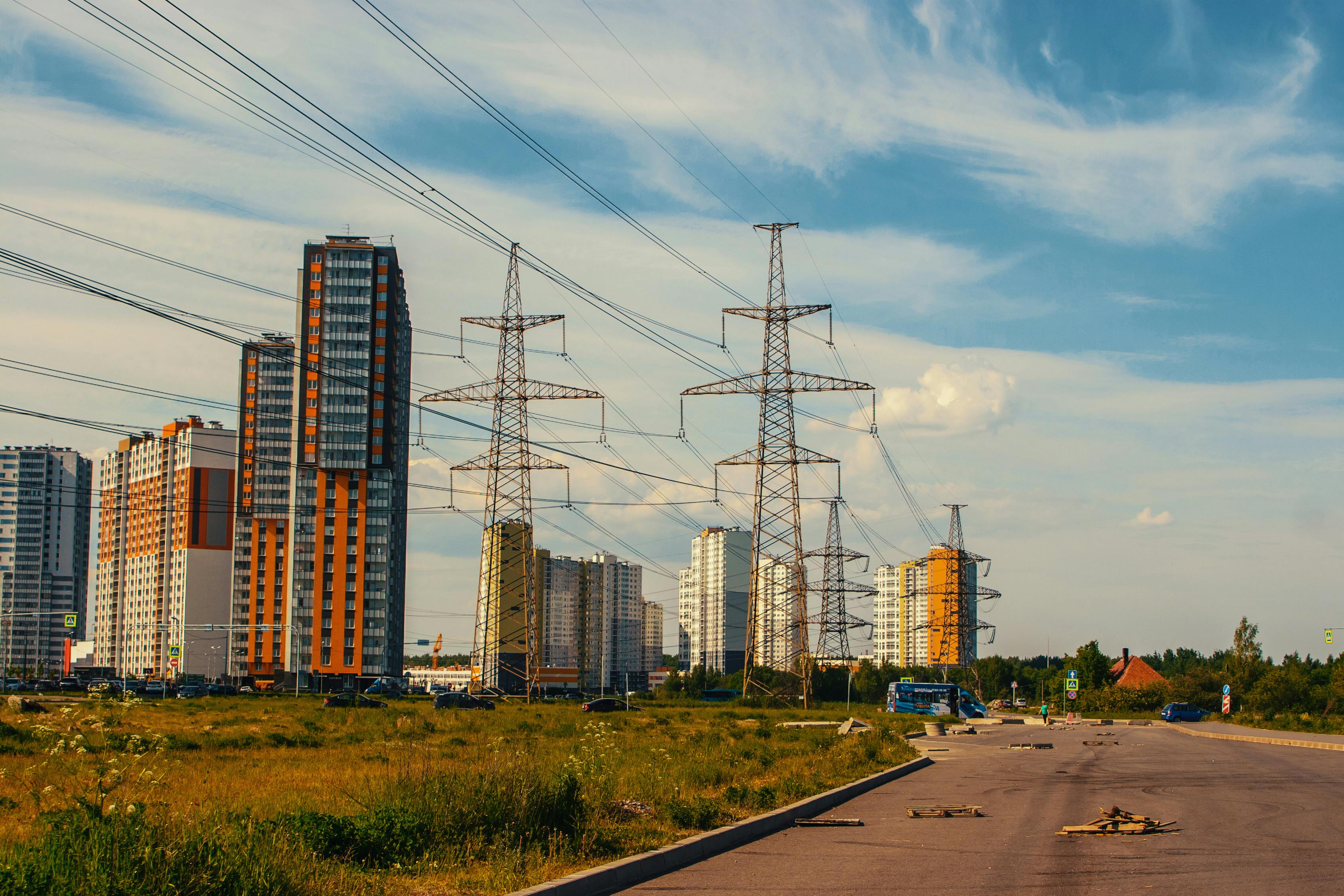 Tall Apartment Buildings and Electricity Towers in City · Free Stock Photo