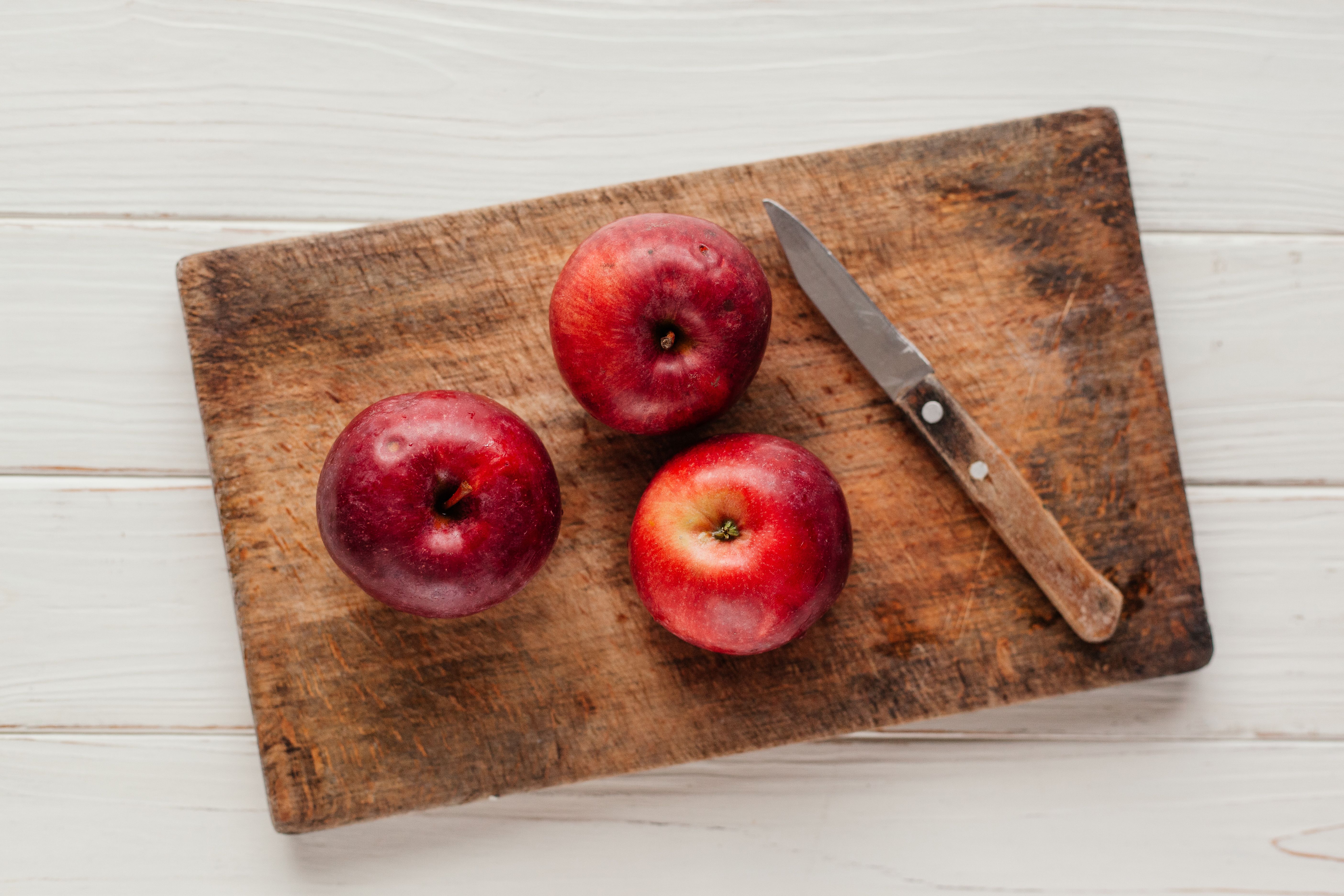 Apples and Knife on a Chopping Board · Free Stock Photo