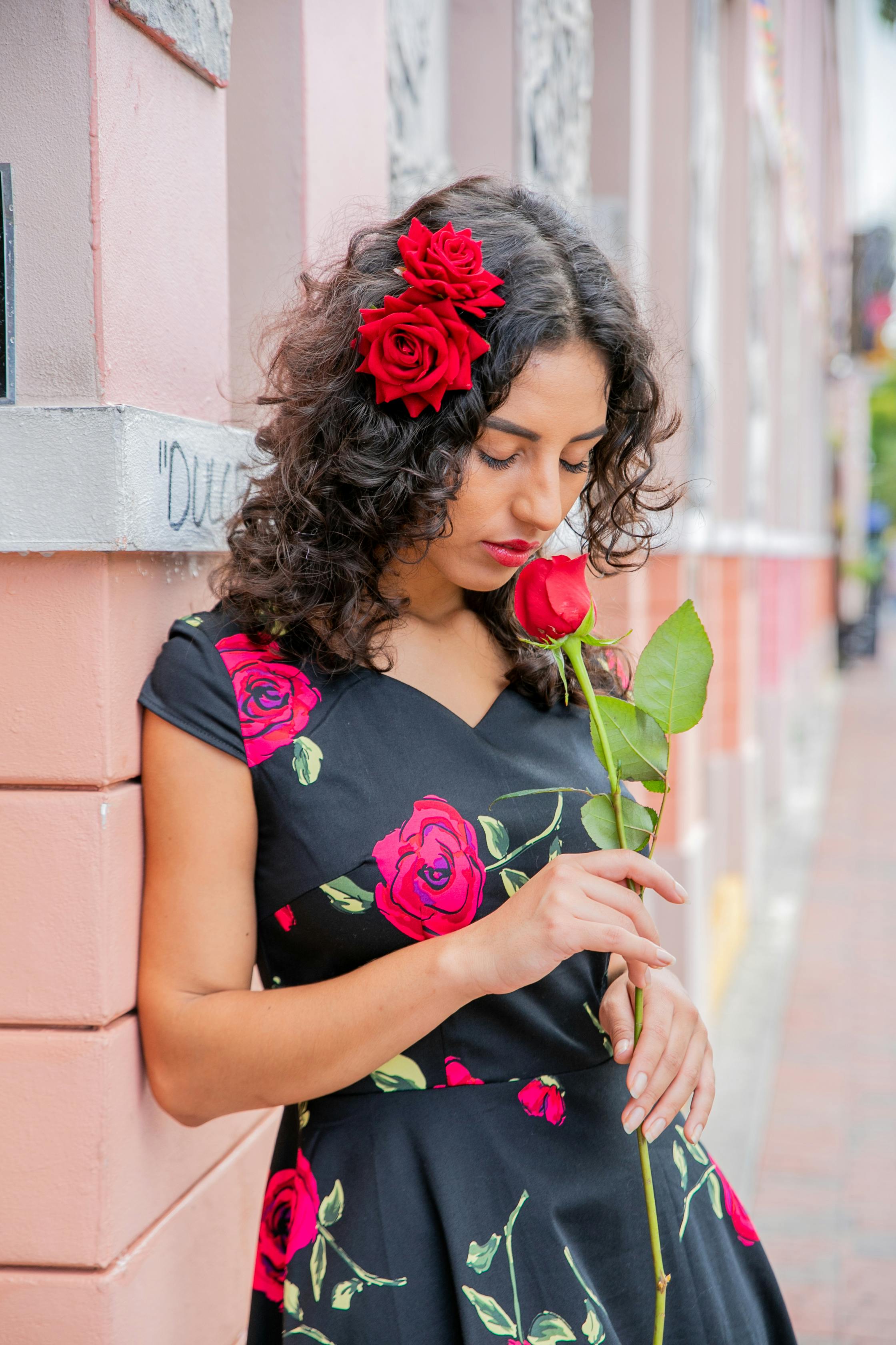 A Woman wearing Floral Dress holding Rose · Free Stock Photo