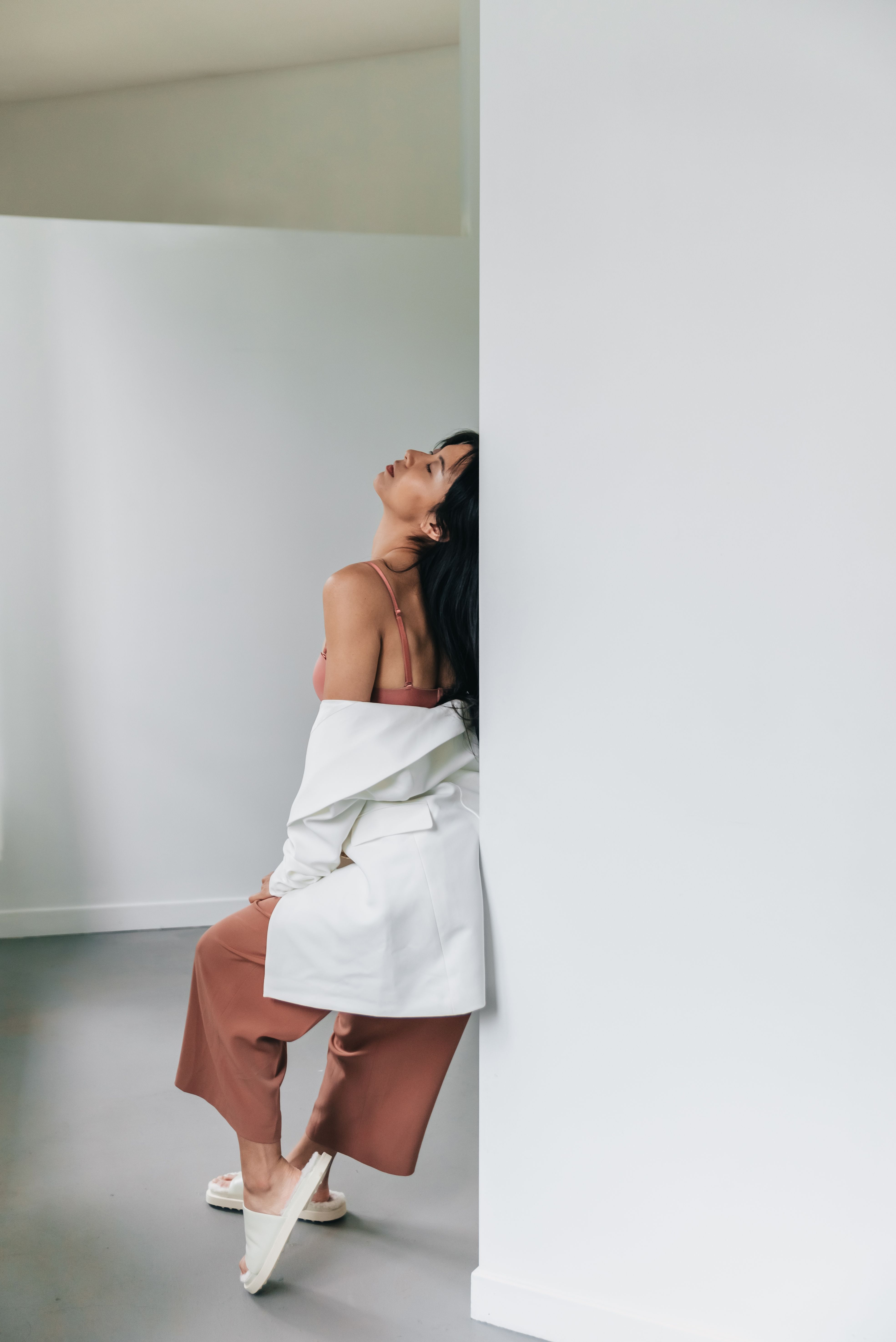 Woman Leaning on Wall · Free Stock Photo