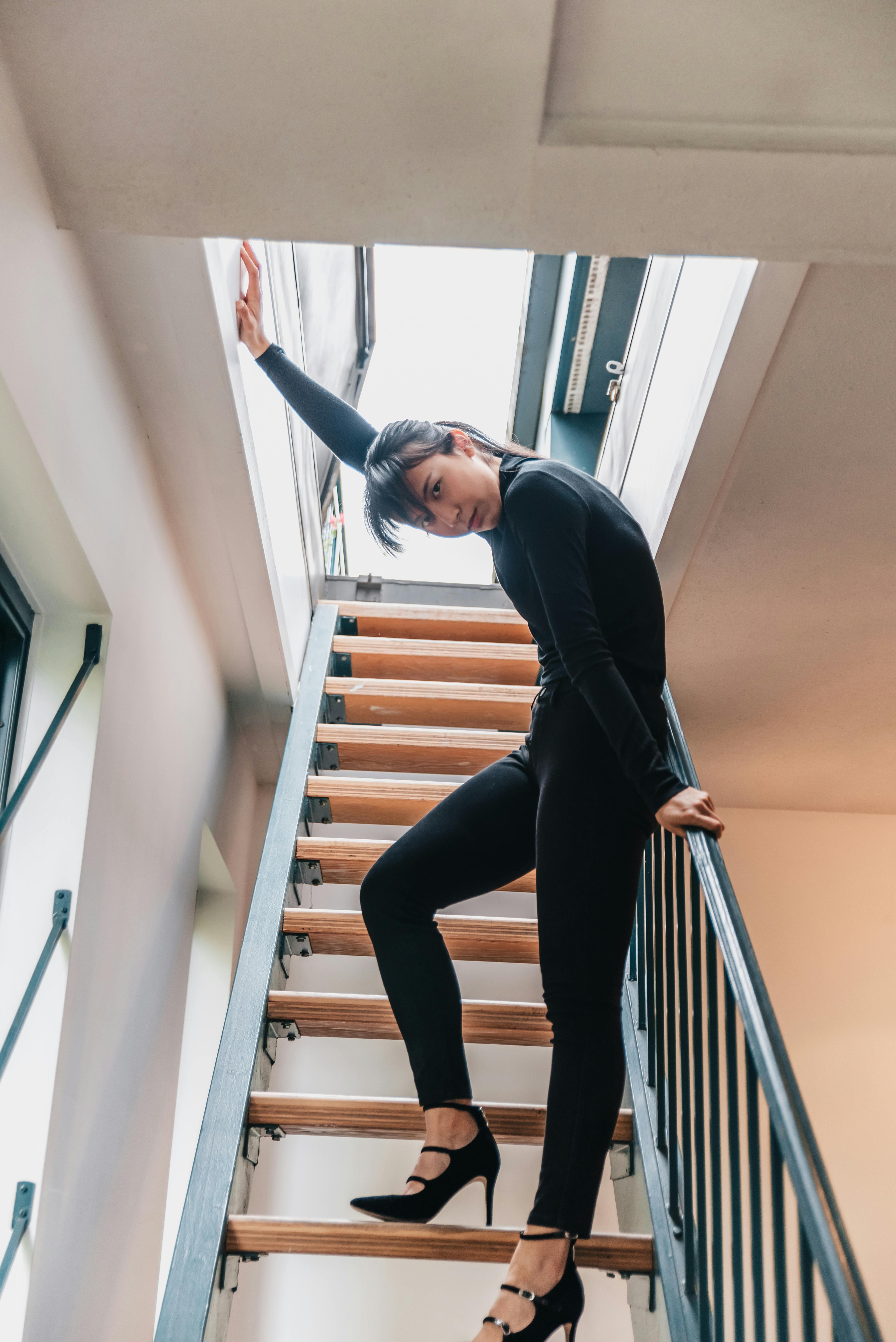 Person Holding a Railing · Free Stock Photo