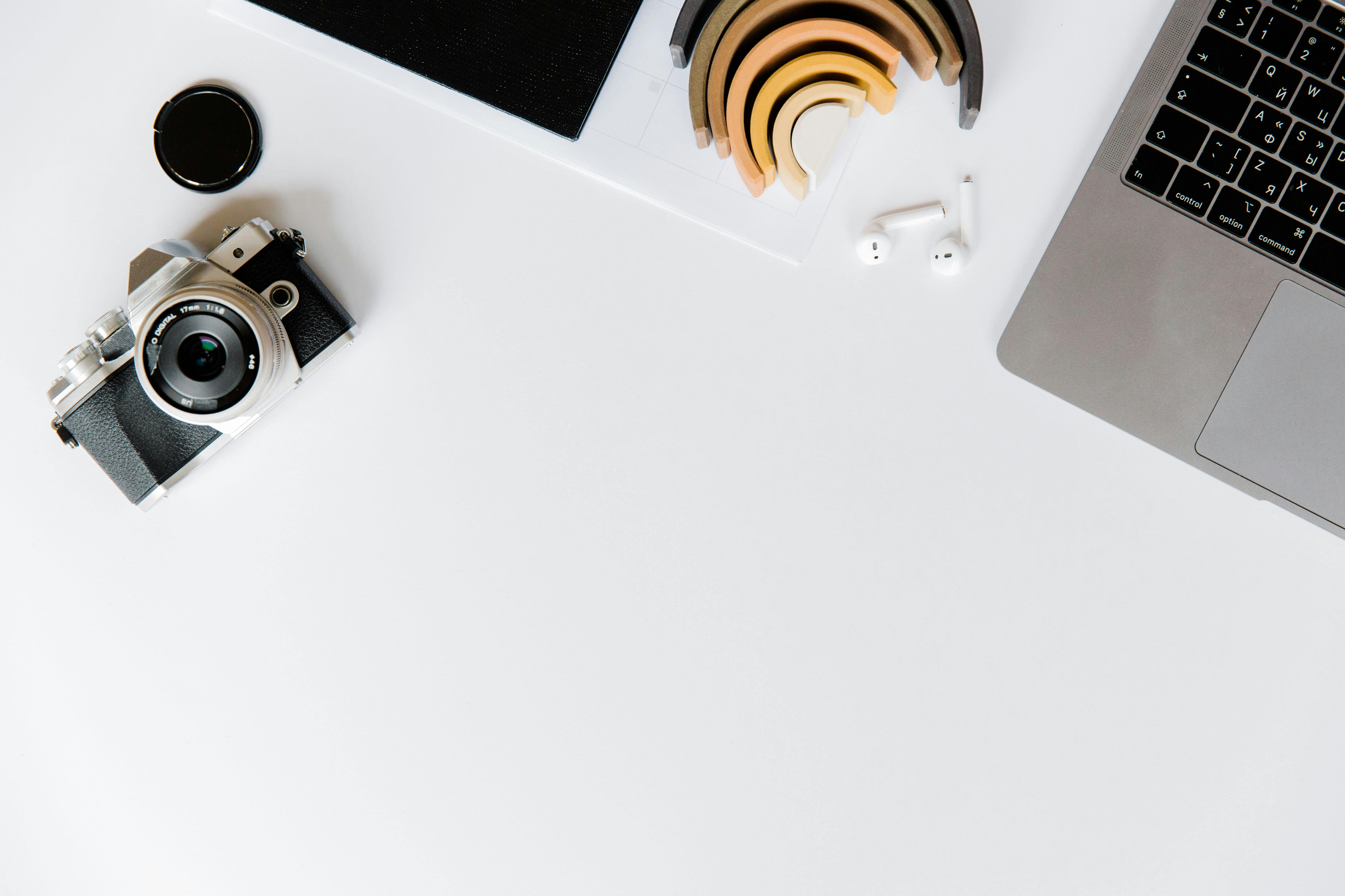 Black and Silver Dslr Camera on the Desk · Free Stock Photo