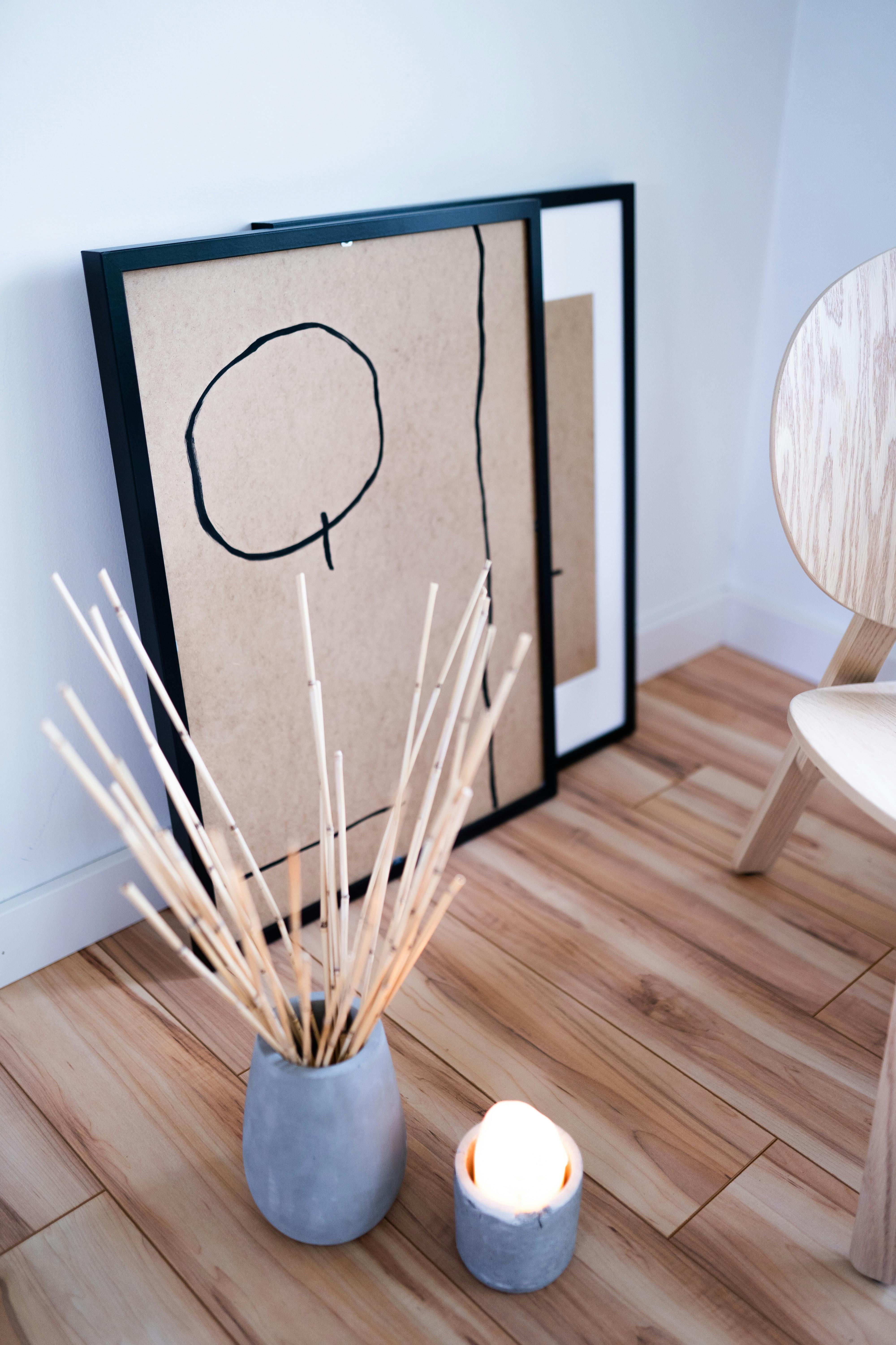 Drawing on Cardboard and Vase with Sticks · Free Stock Photo