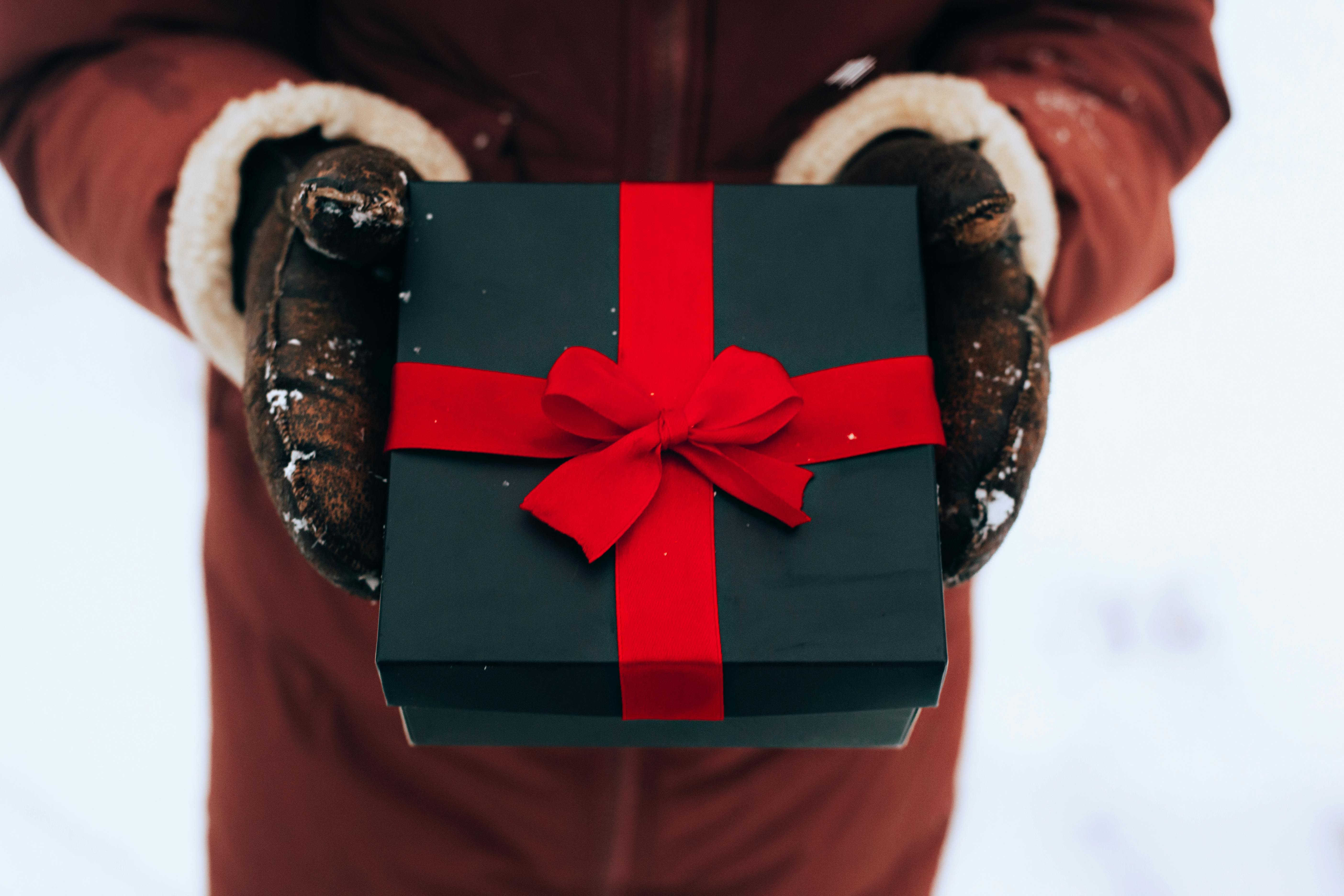 Photo of a Black Box with a Red Ribbon · Free Stock Photo