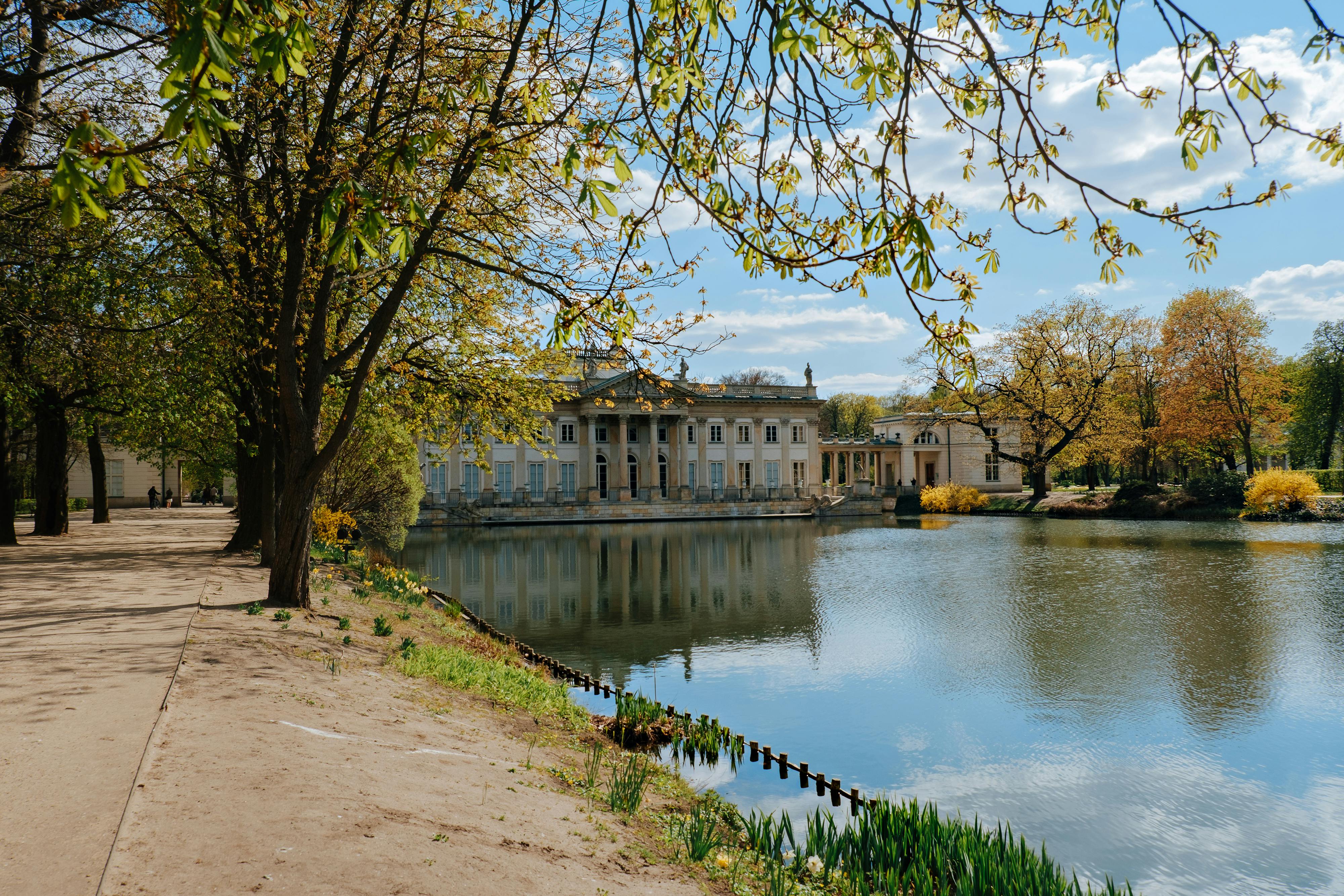 White Concrete Building Near River · Free Stock Photo