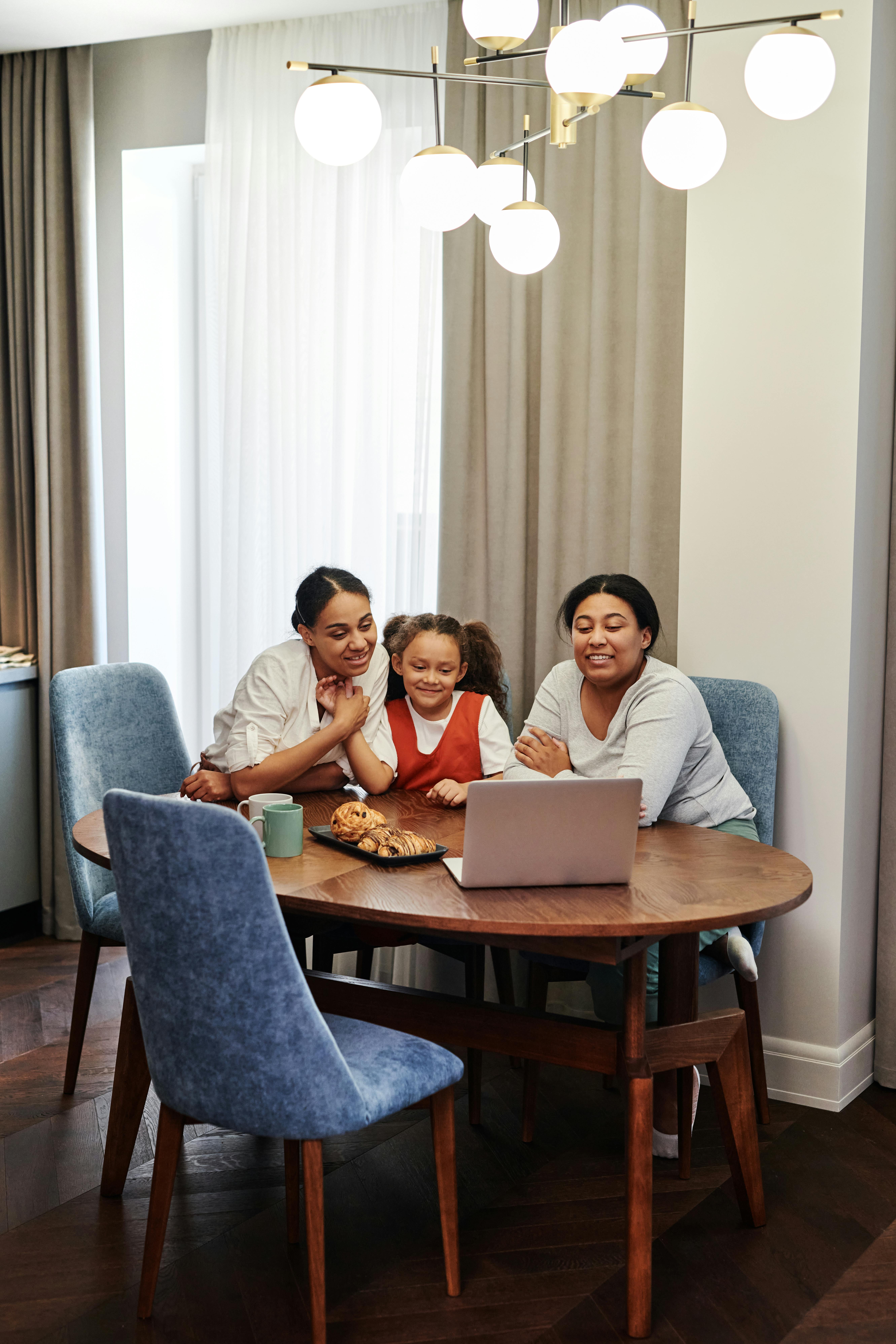 People Sitting at the Dining Table · Free Stock Photo