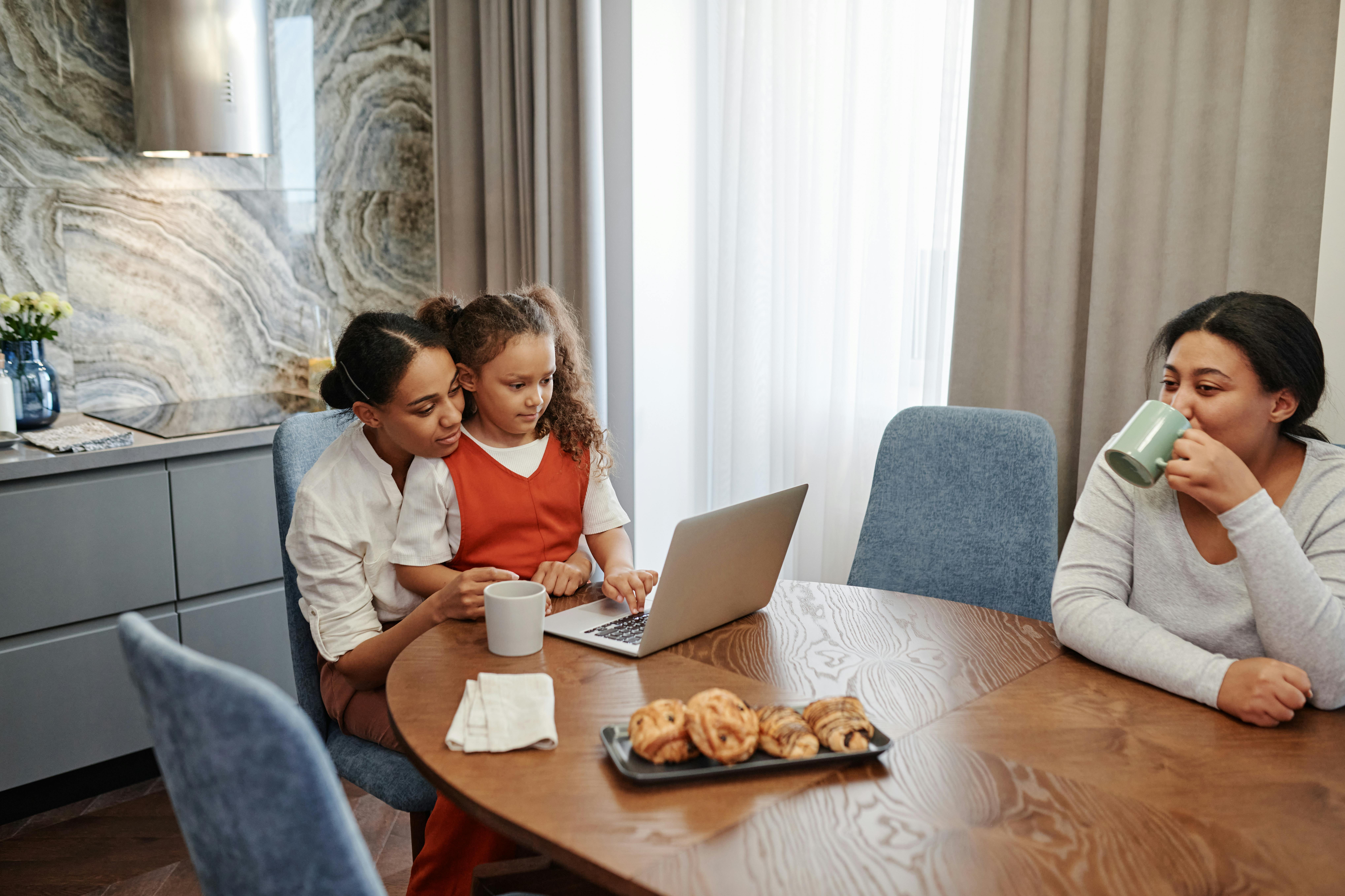 People Sitting at the Dining Table · Free Stock Photo